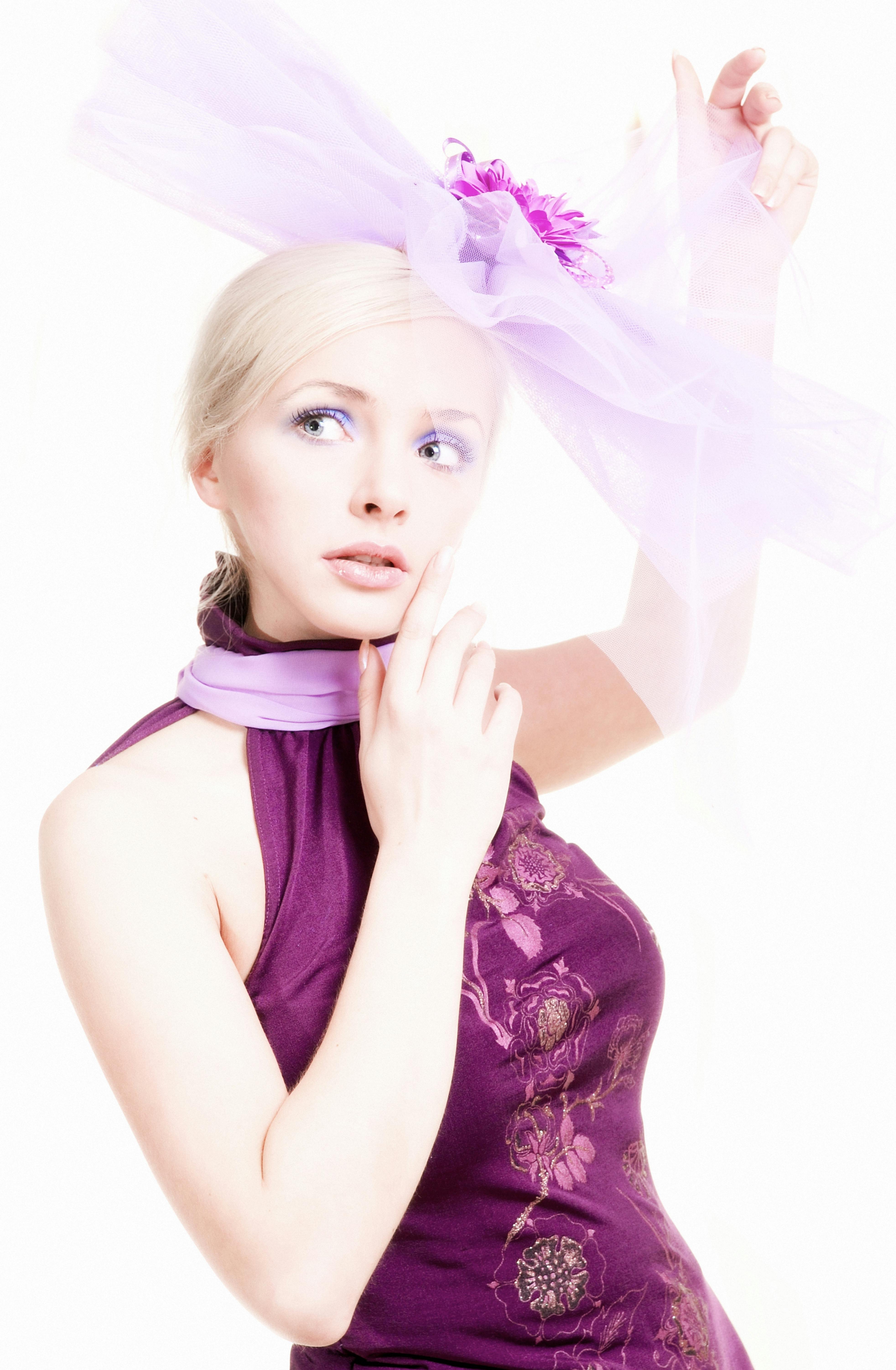 A Woman in a Bodysuit Blowing Powder · Free Stock Photo