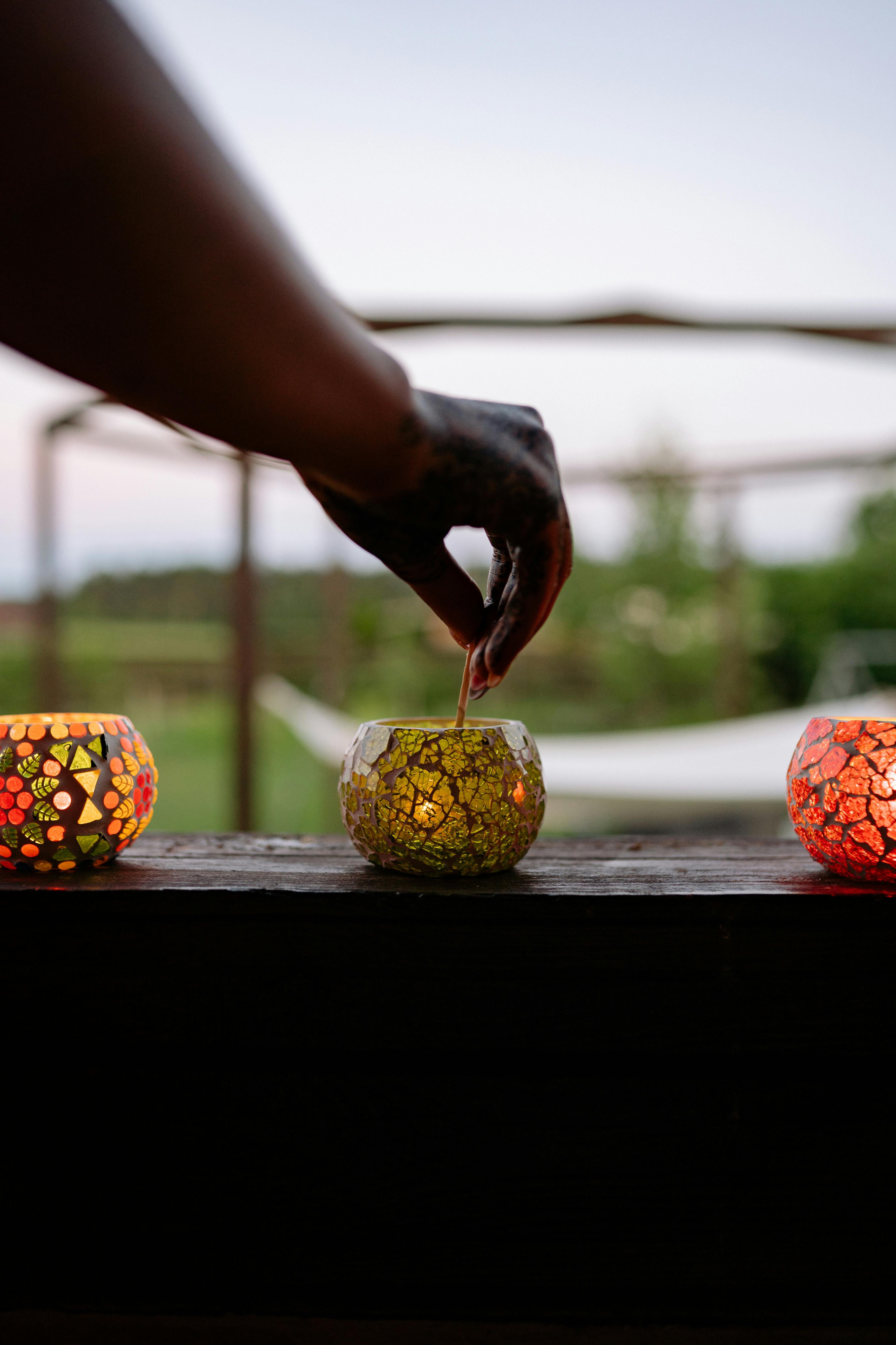 A Hand Lightning the Candle Using a Matchstick · Free Stock Photo