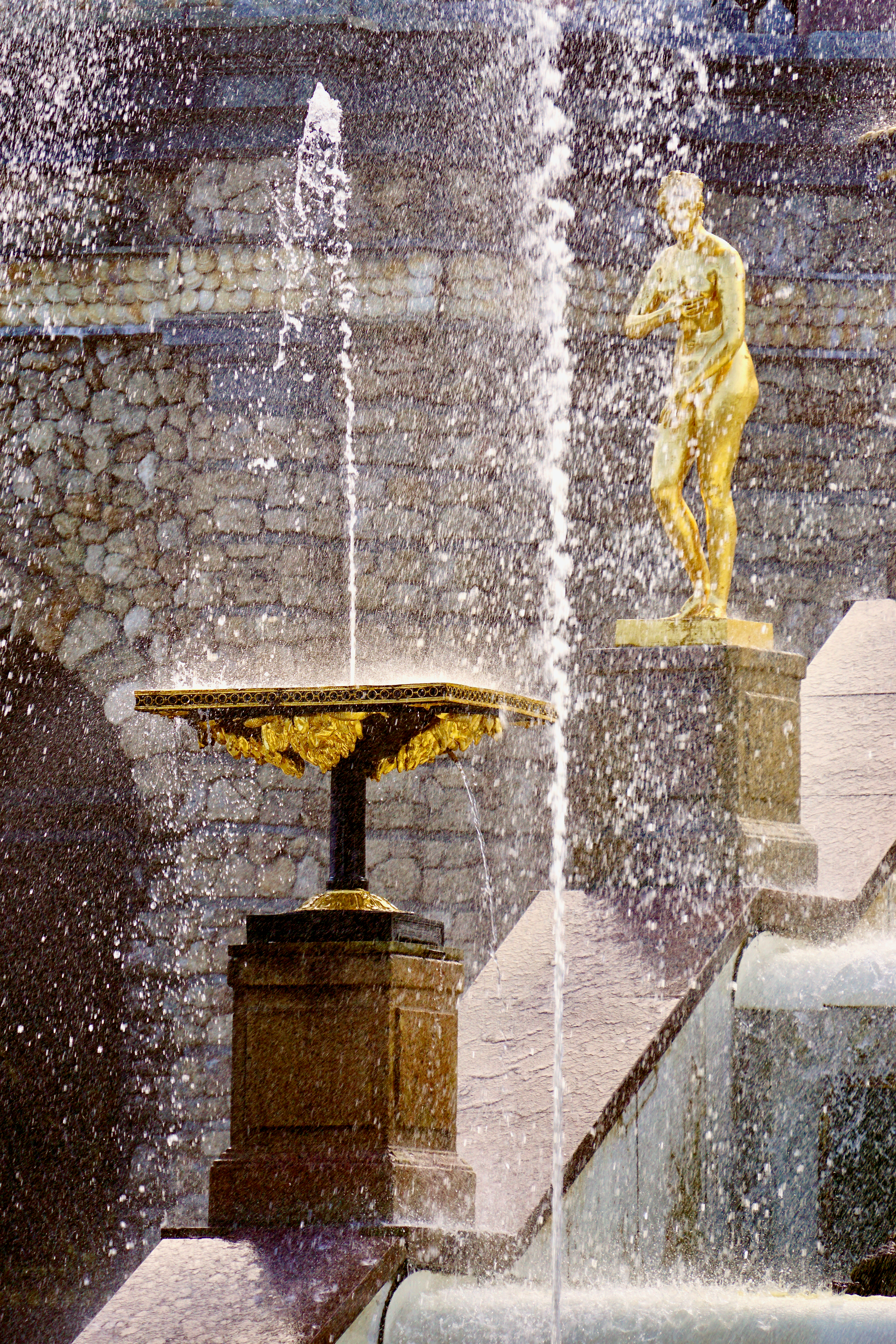 Gold Statue near a Water Fountain · Free Stock Photo