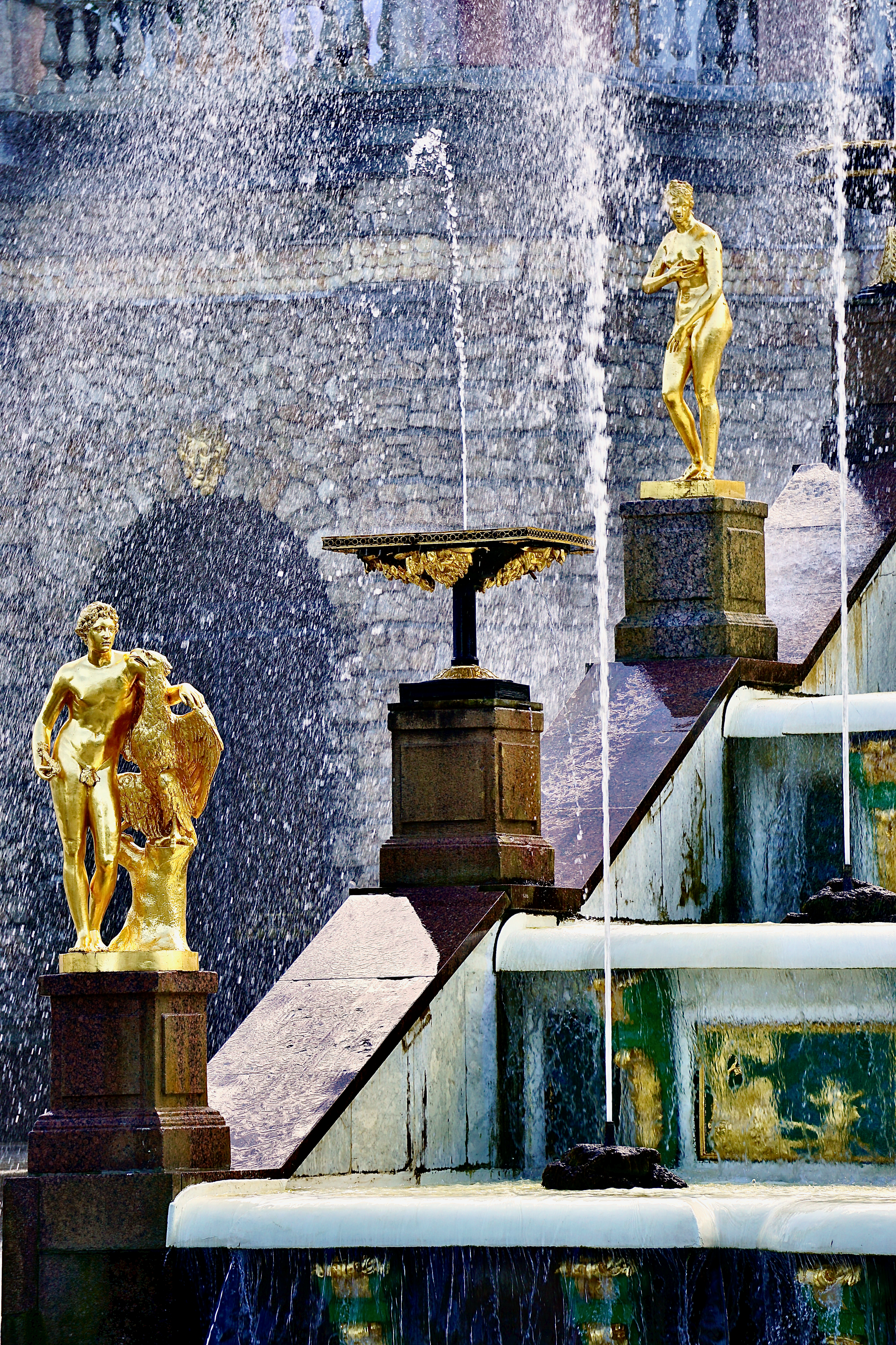 Gold Statue near a Water Fountain · Free Stock Photo
