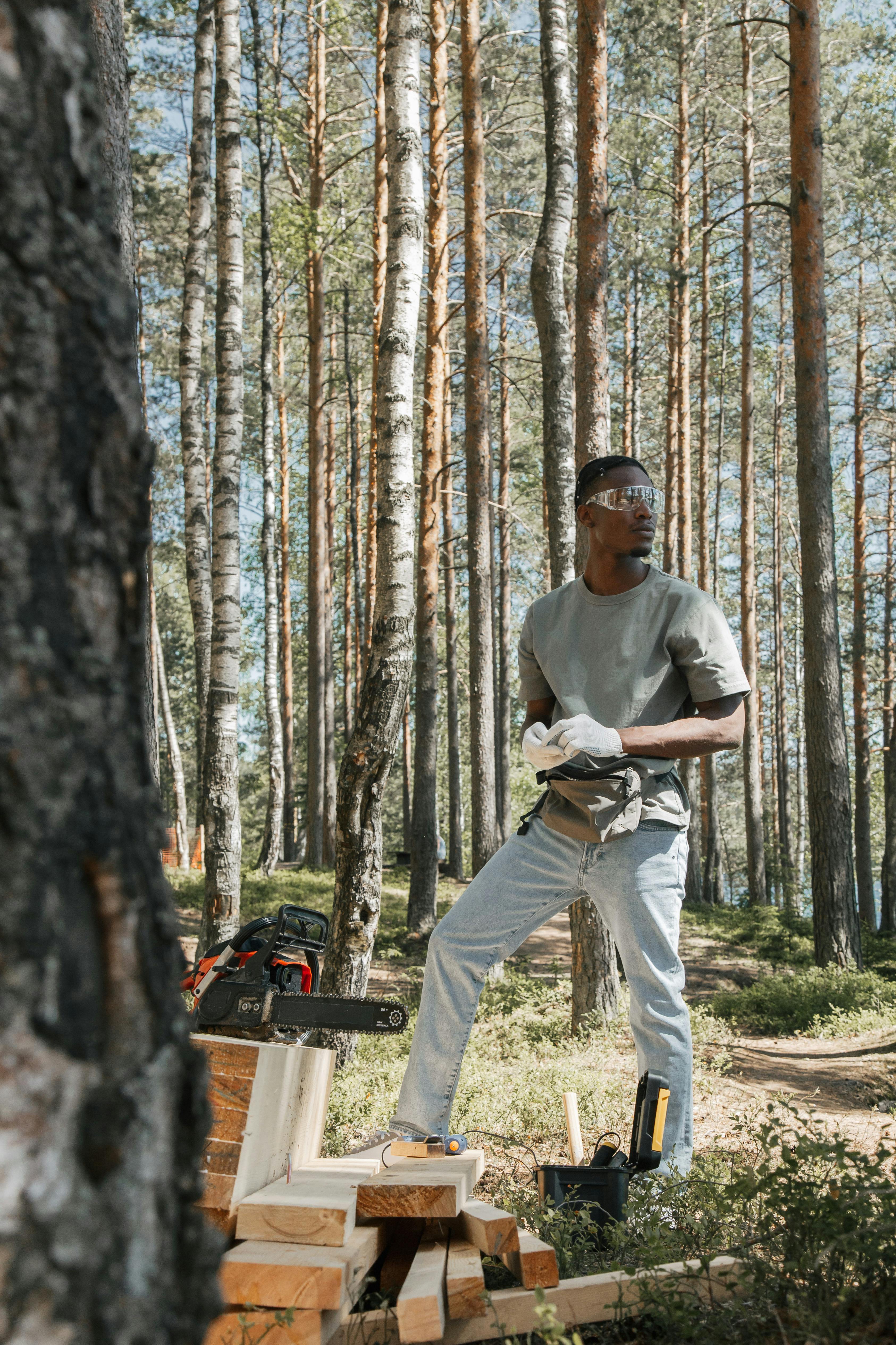 A Man Standing on Wood Planks · Free Stock Photo