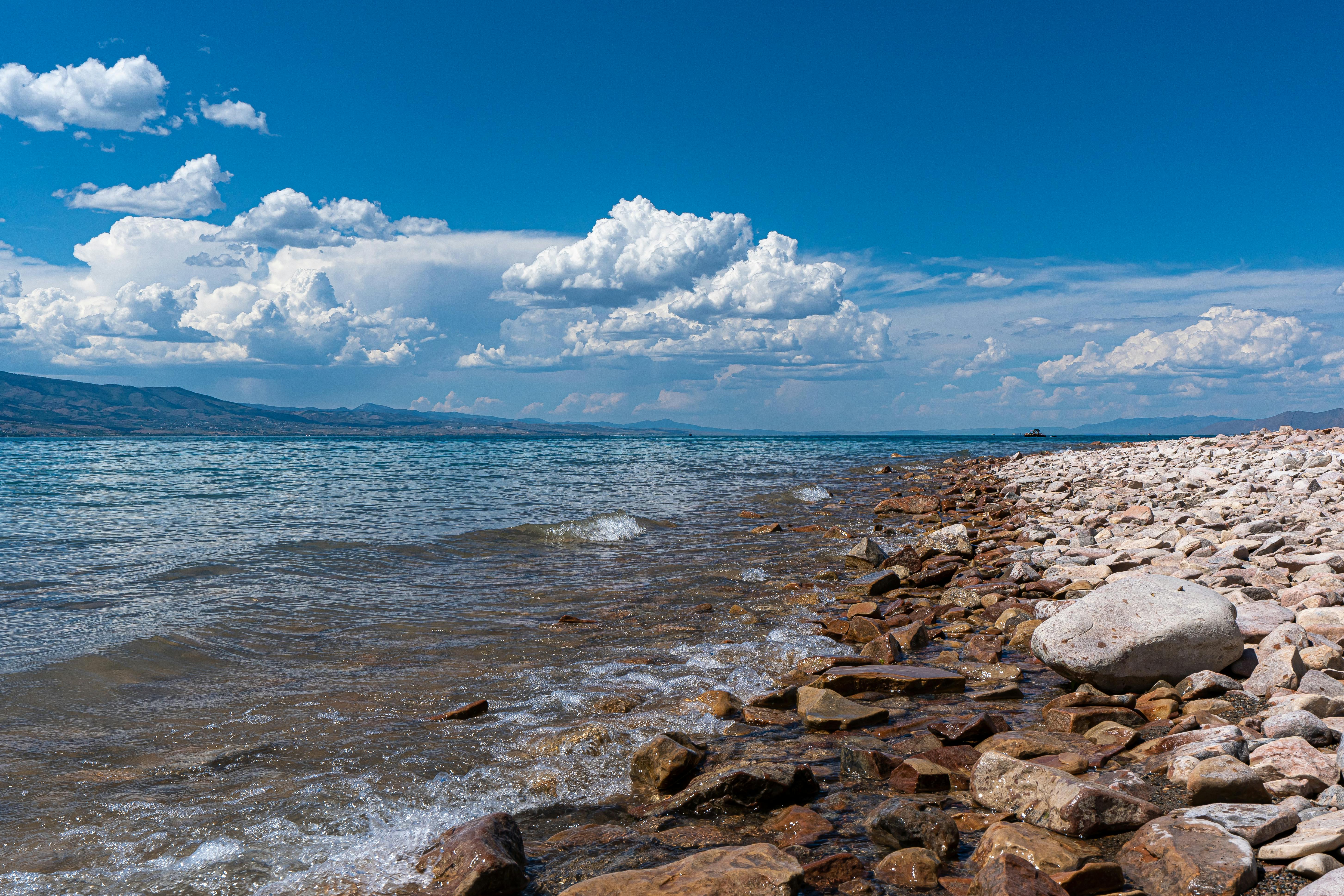 A Rocky Shore under Clear Blue Sky · Free Stock Photo