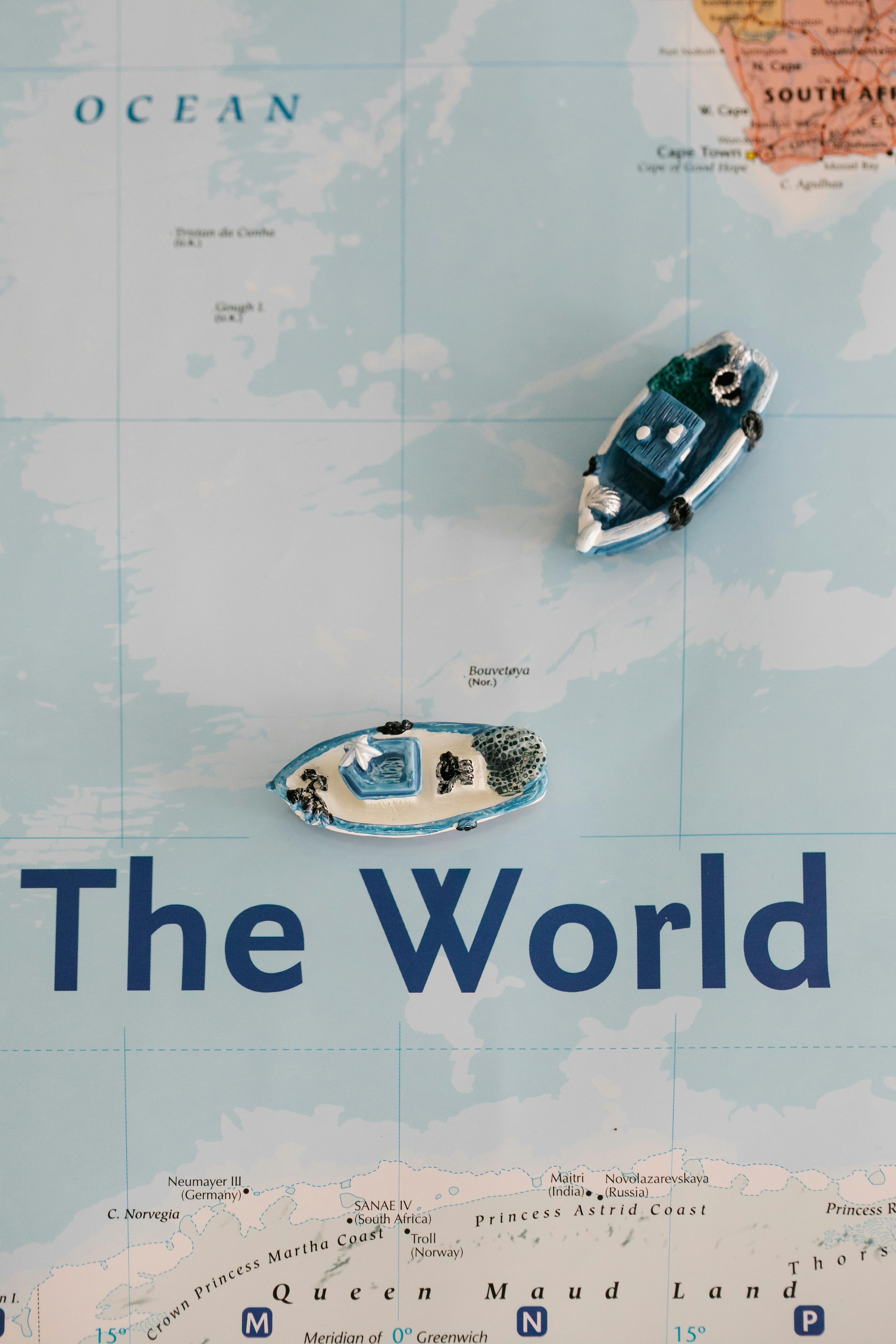 Toy Ship on Paper Map · Free Stock Photo