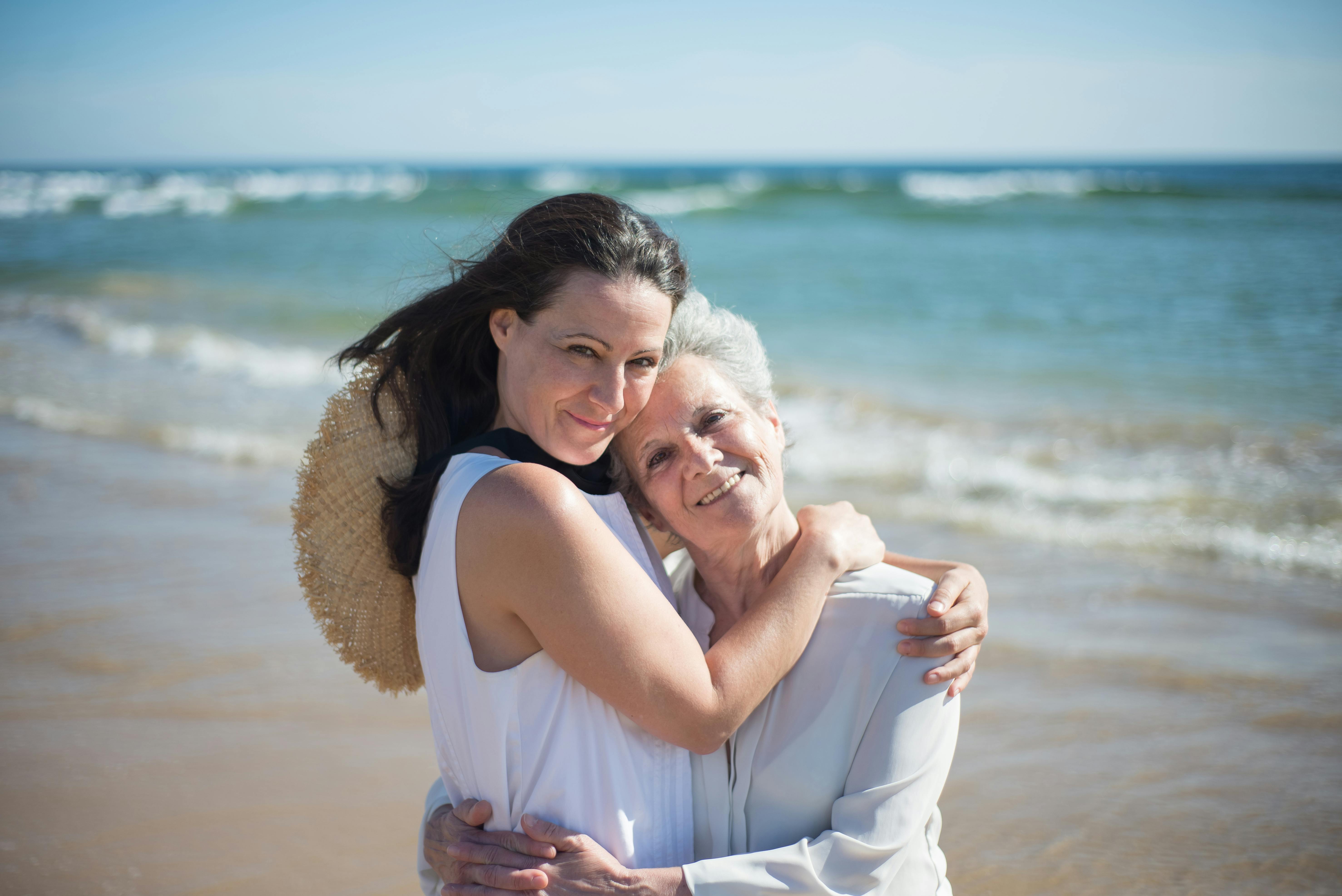 Women Hugging on the Beach · Free Stock Photo