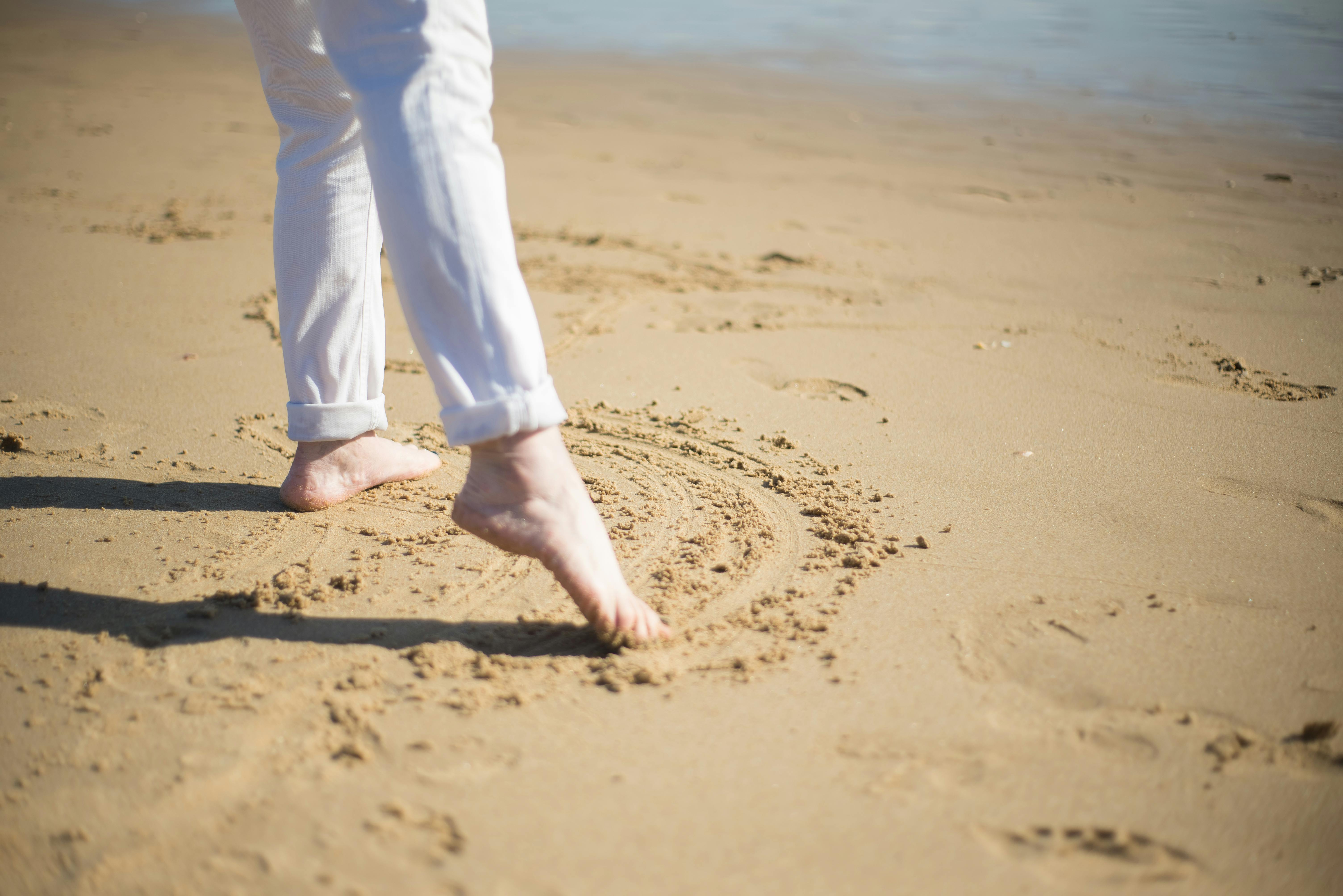 Barefooted Person Playing the Sand · Free Stock Photo