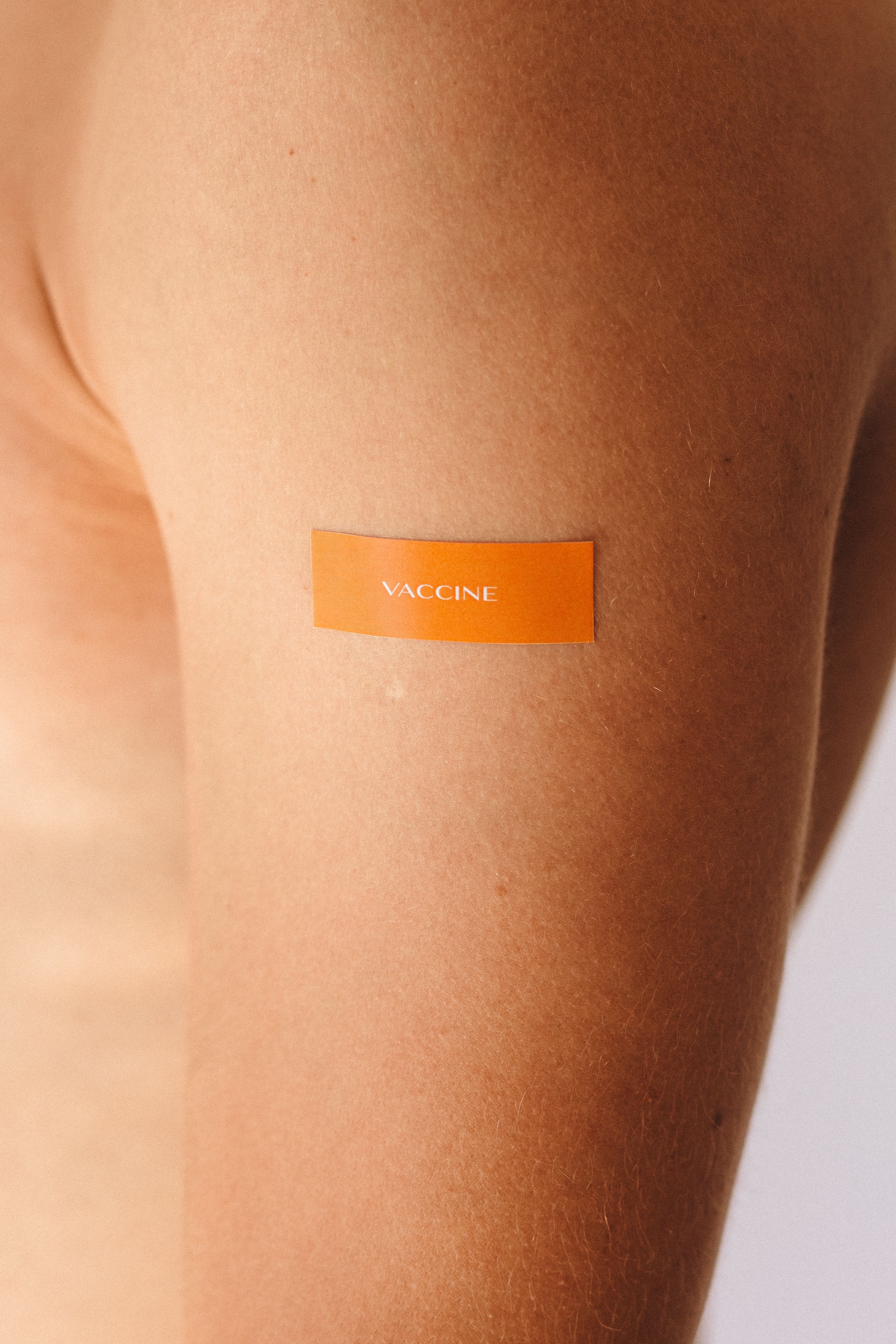 Vaccine Sticker on Bare Shoulder · Free Stock Photo