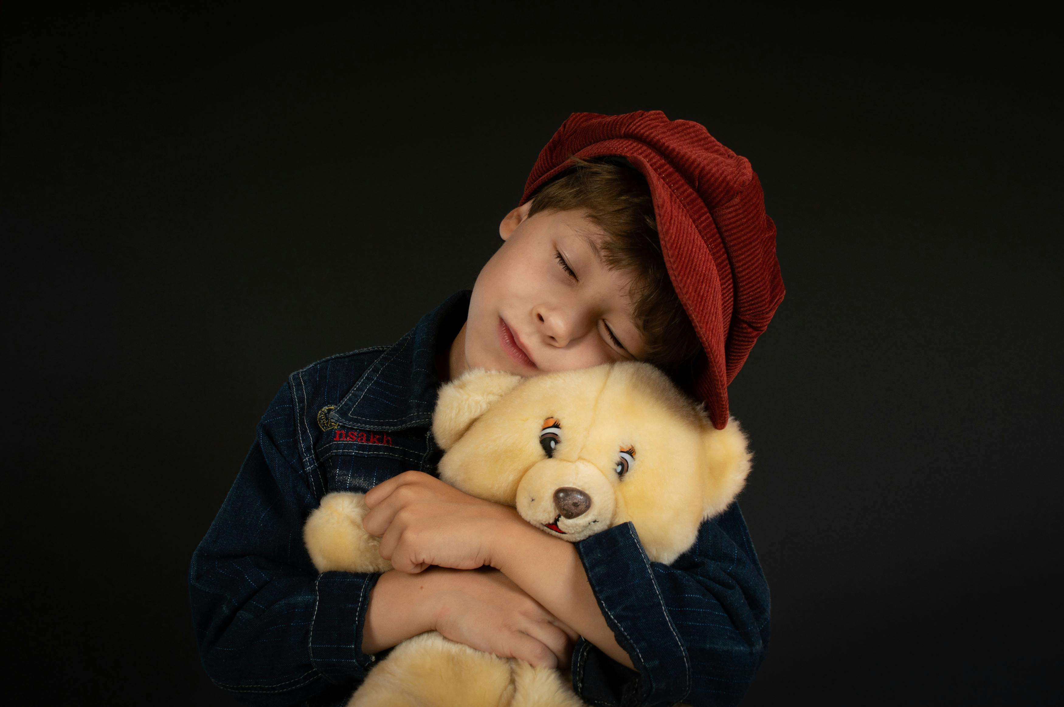 A Boy Hugging His Stuffed Animal · Free Stock Photo