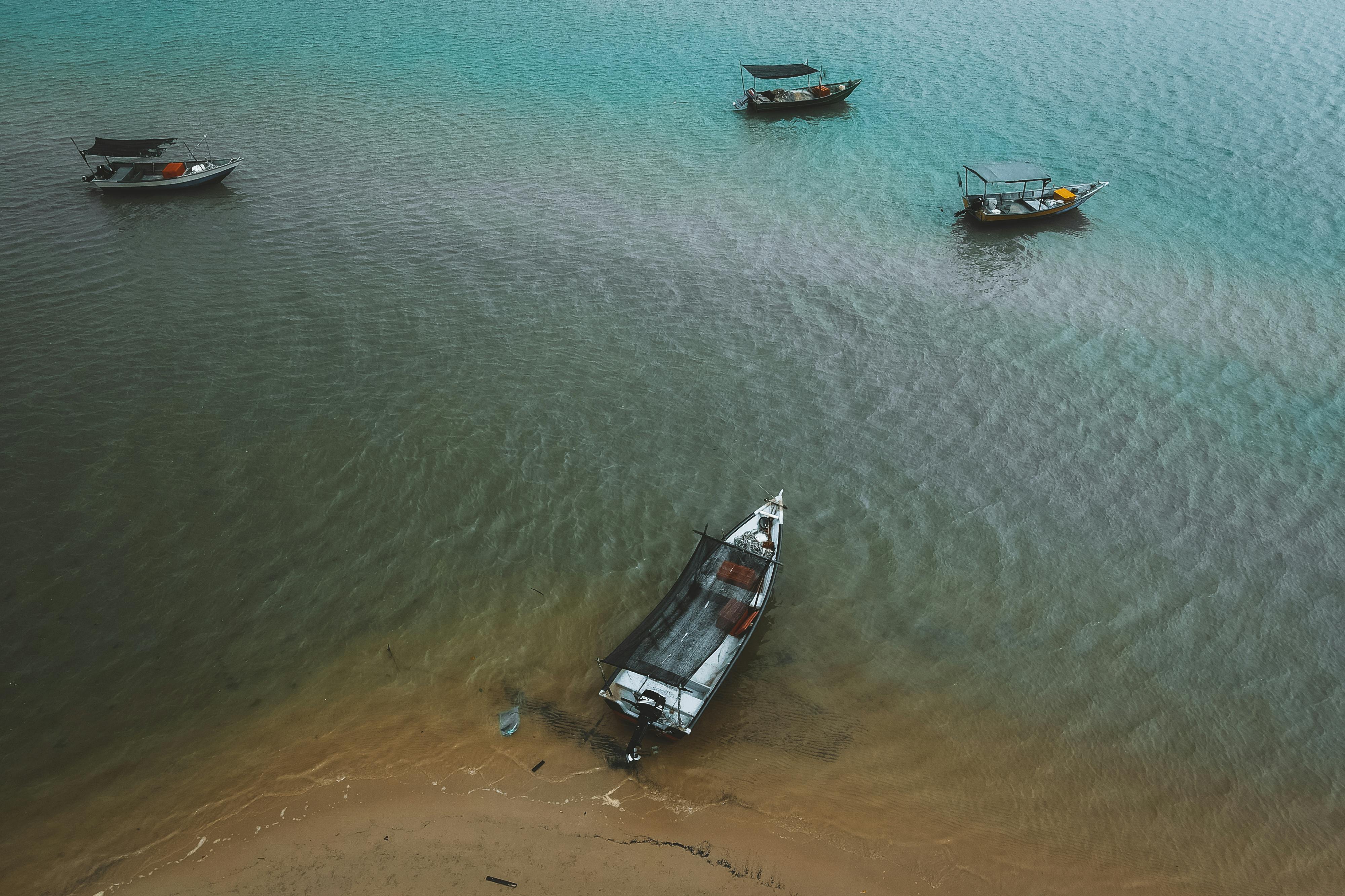Aerial Photography of Boats on Body of Water · Free Stock Photo