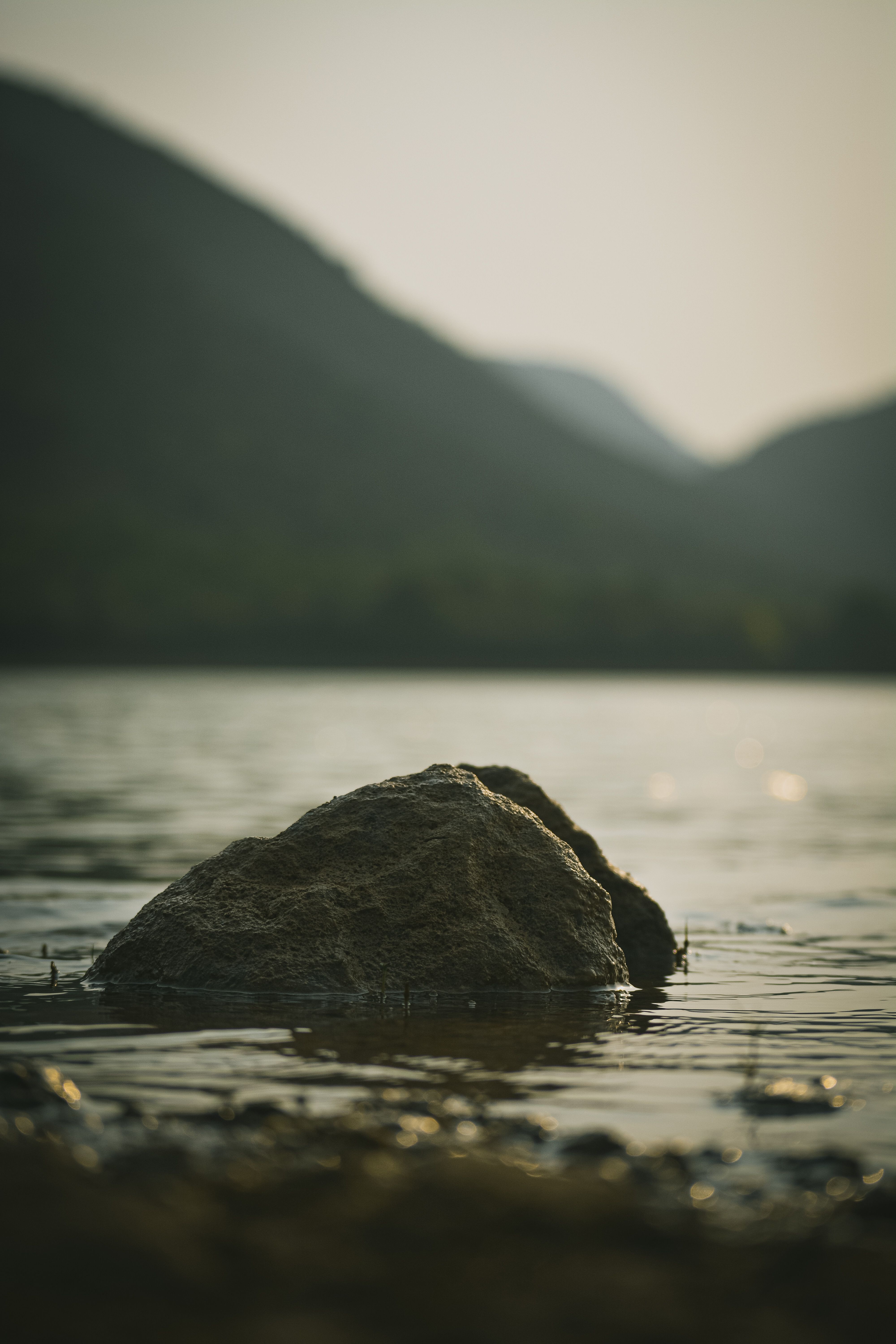 Boy Touching A Big Rock · Free Stock Photo