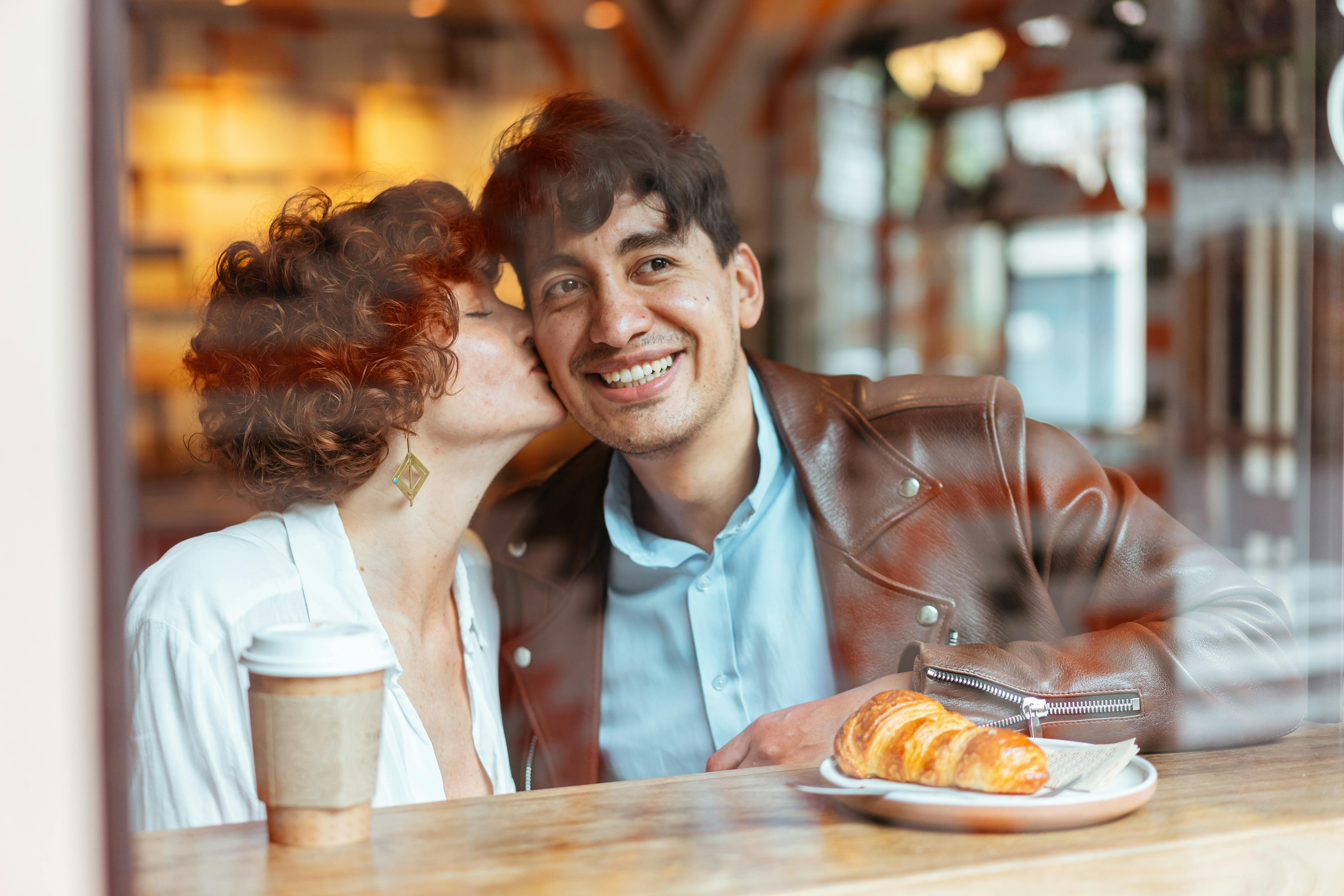 Man Hugging Woman And Having Coffee · Free Stock Photo
