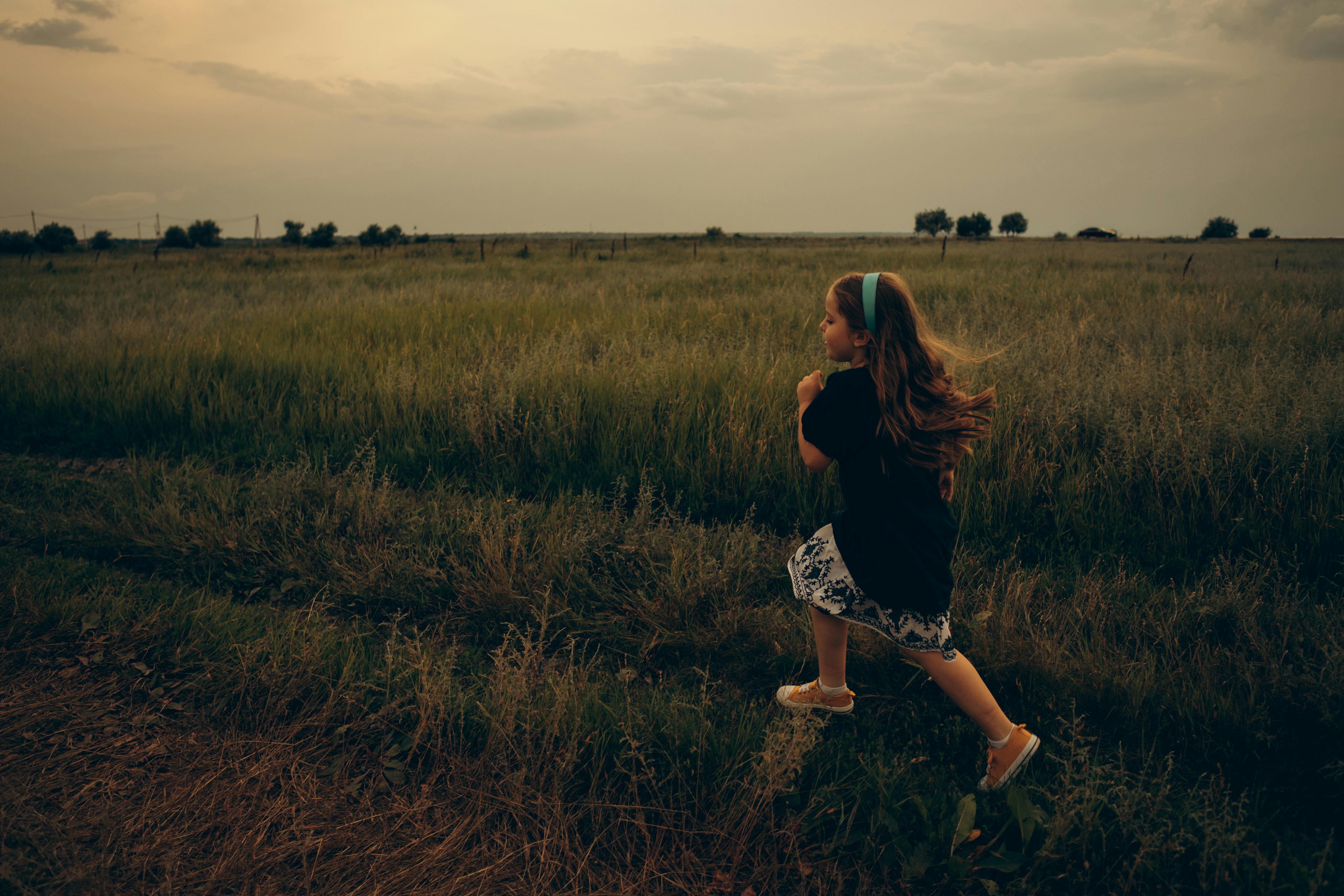 Girls Running on Green Grass Field · Free Stock Photo