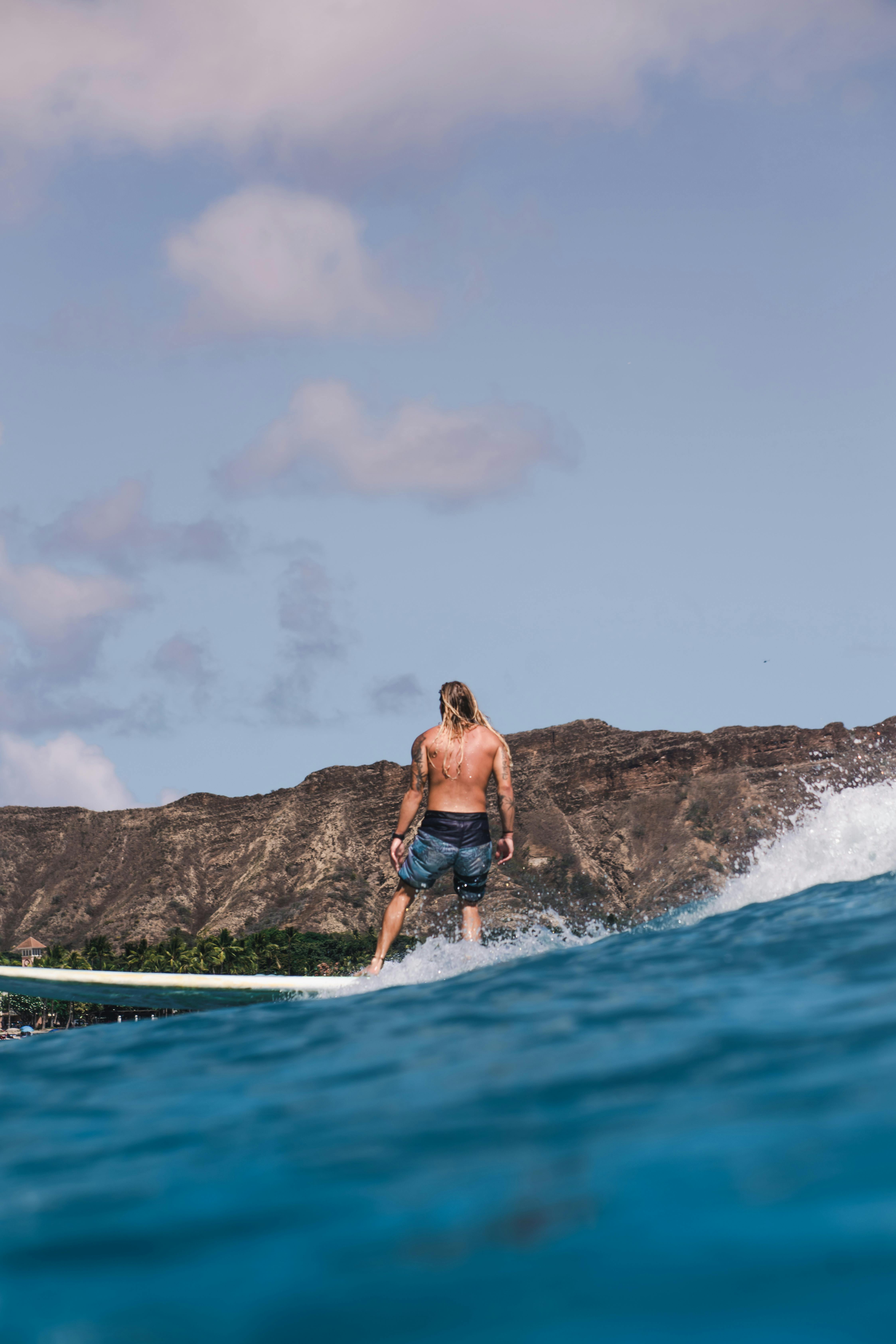 Man Surfing on Sea Waves · Free Stock Photo