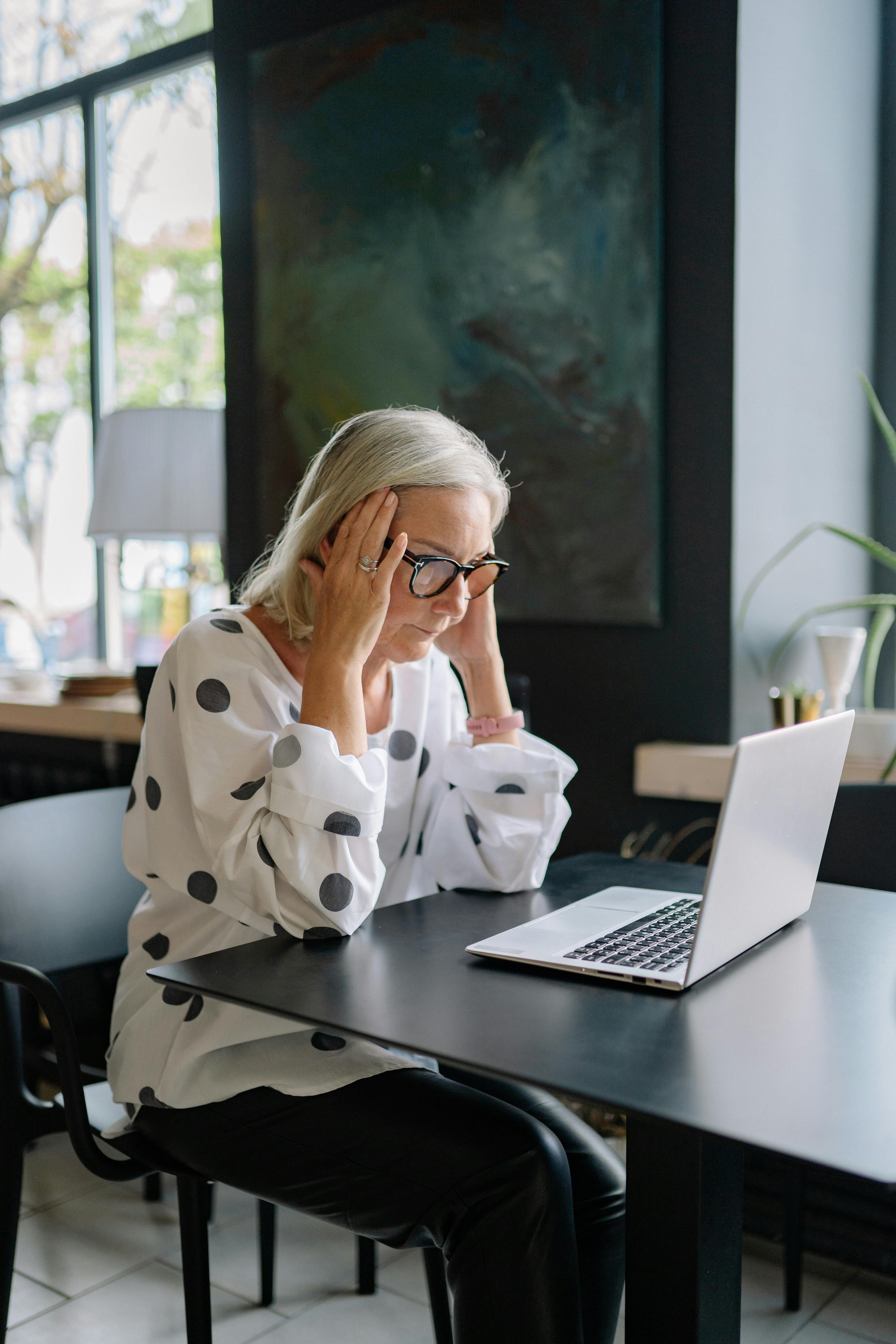 Woman Stressed at Work · Free Stock Photo