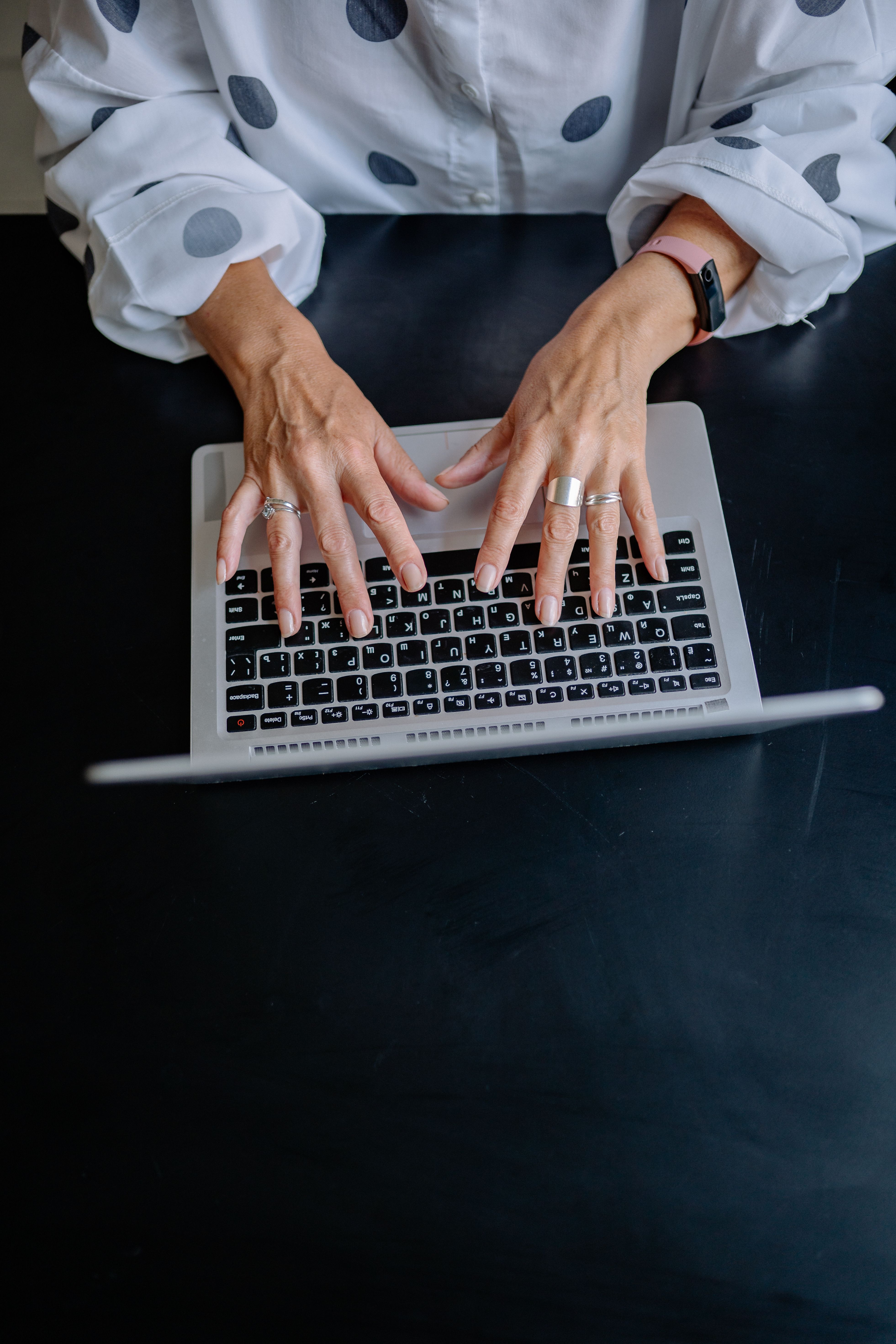 A Person Typing on a Laptop · Free Stock Photo