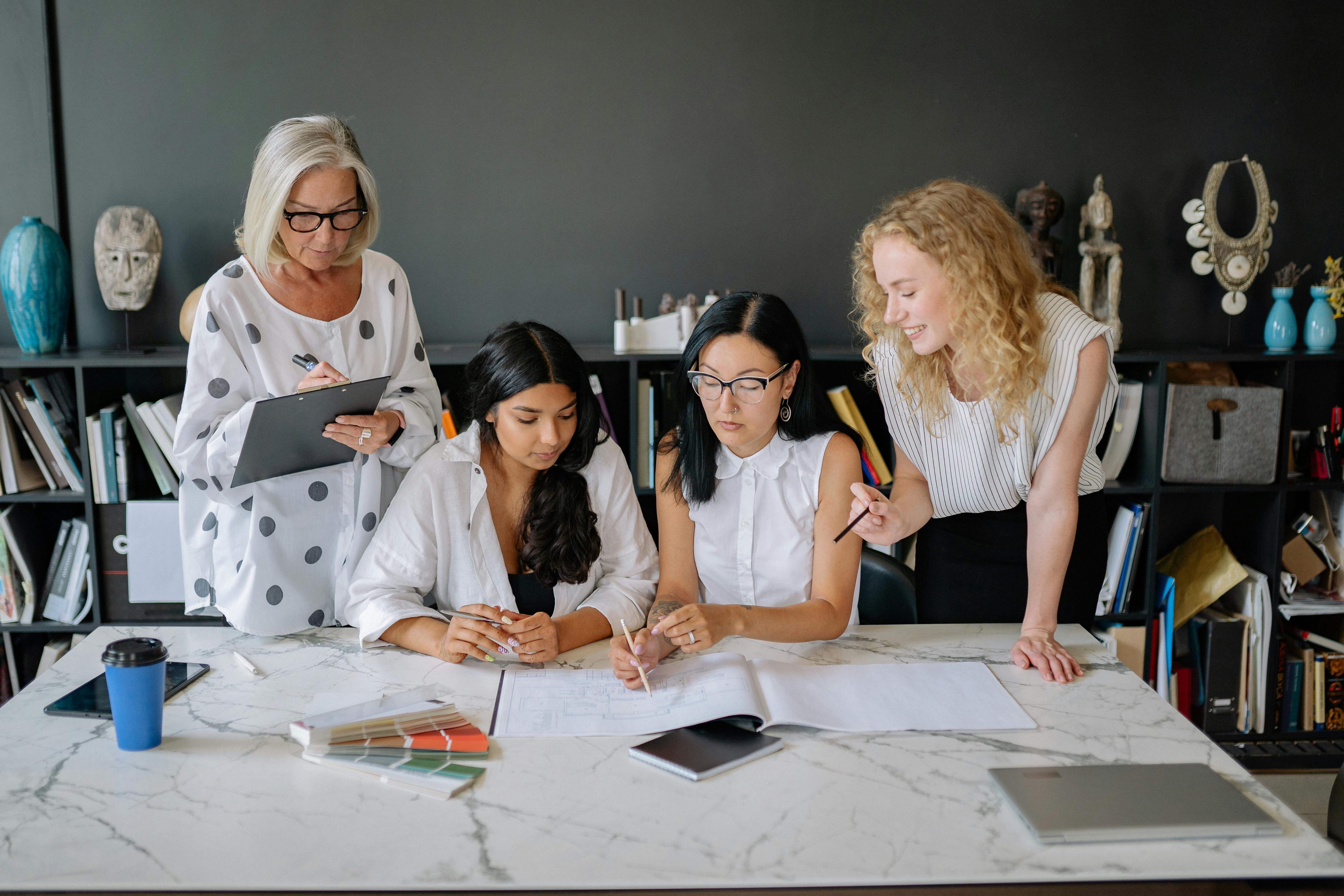 A Group of Women Planning Together · Free Stock Photo