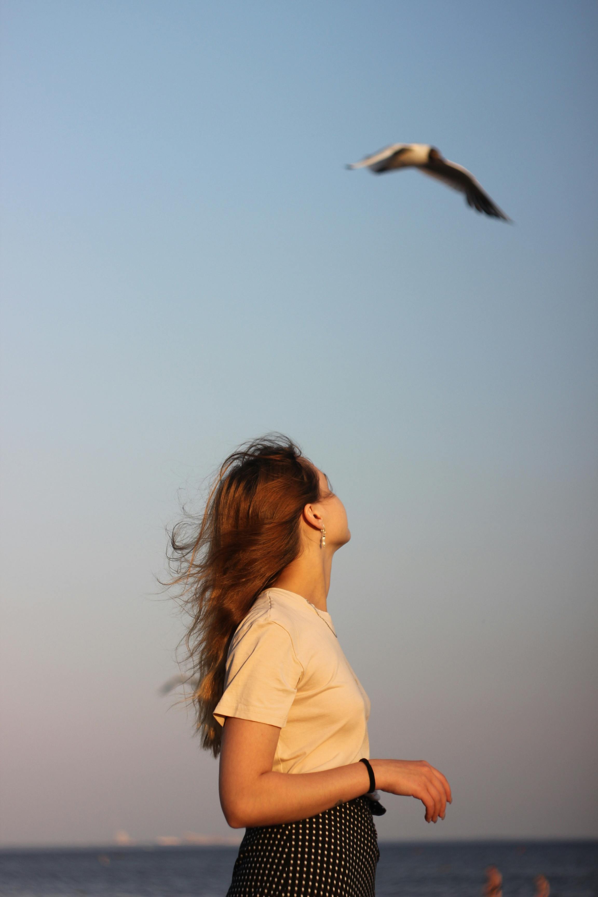 Woman Looking At Bird Photos, Download The BEST Free Woman Looking At ...