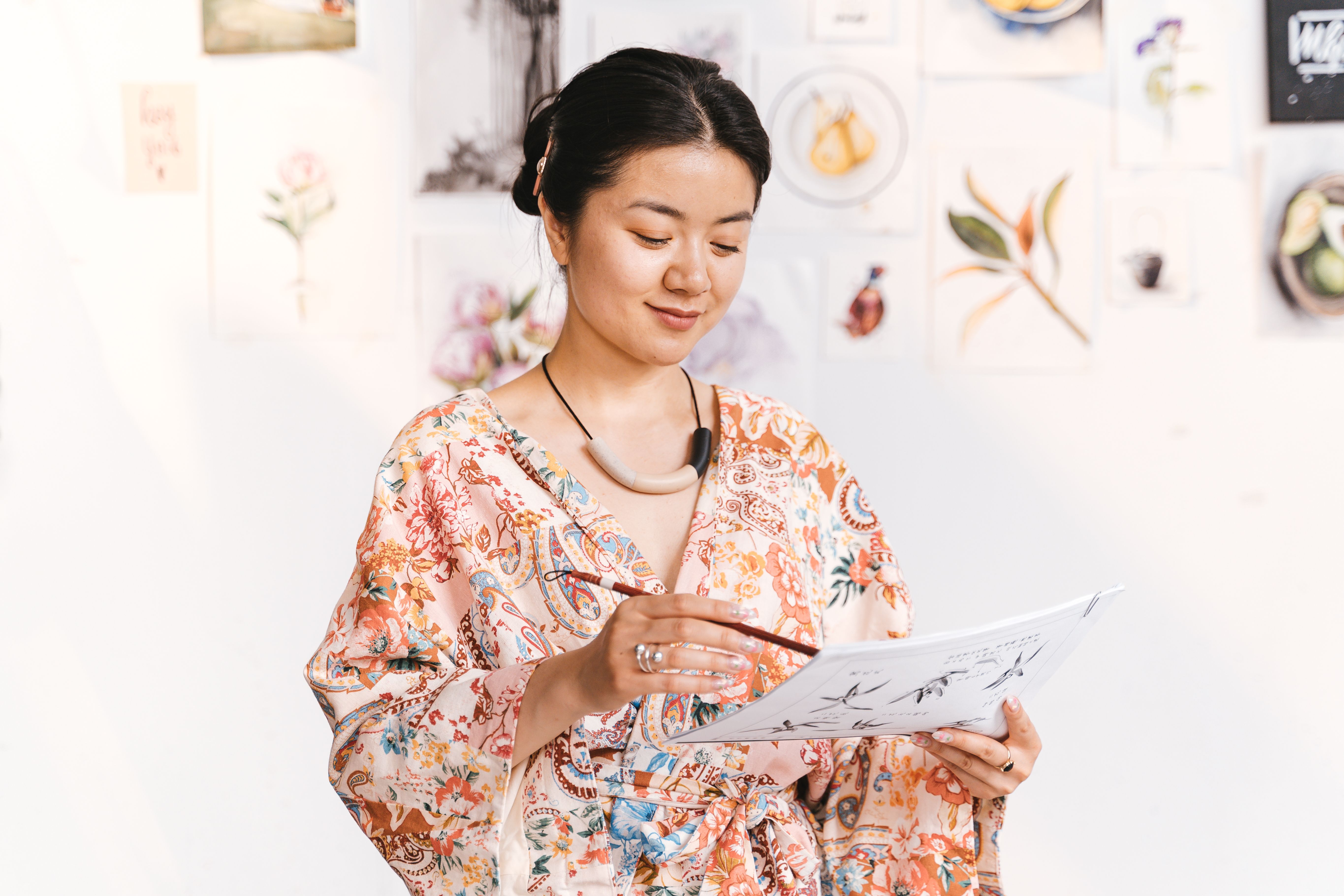 Woman Holding Drawings · Free Stock Photo