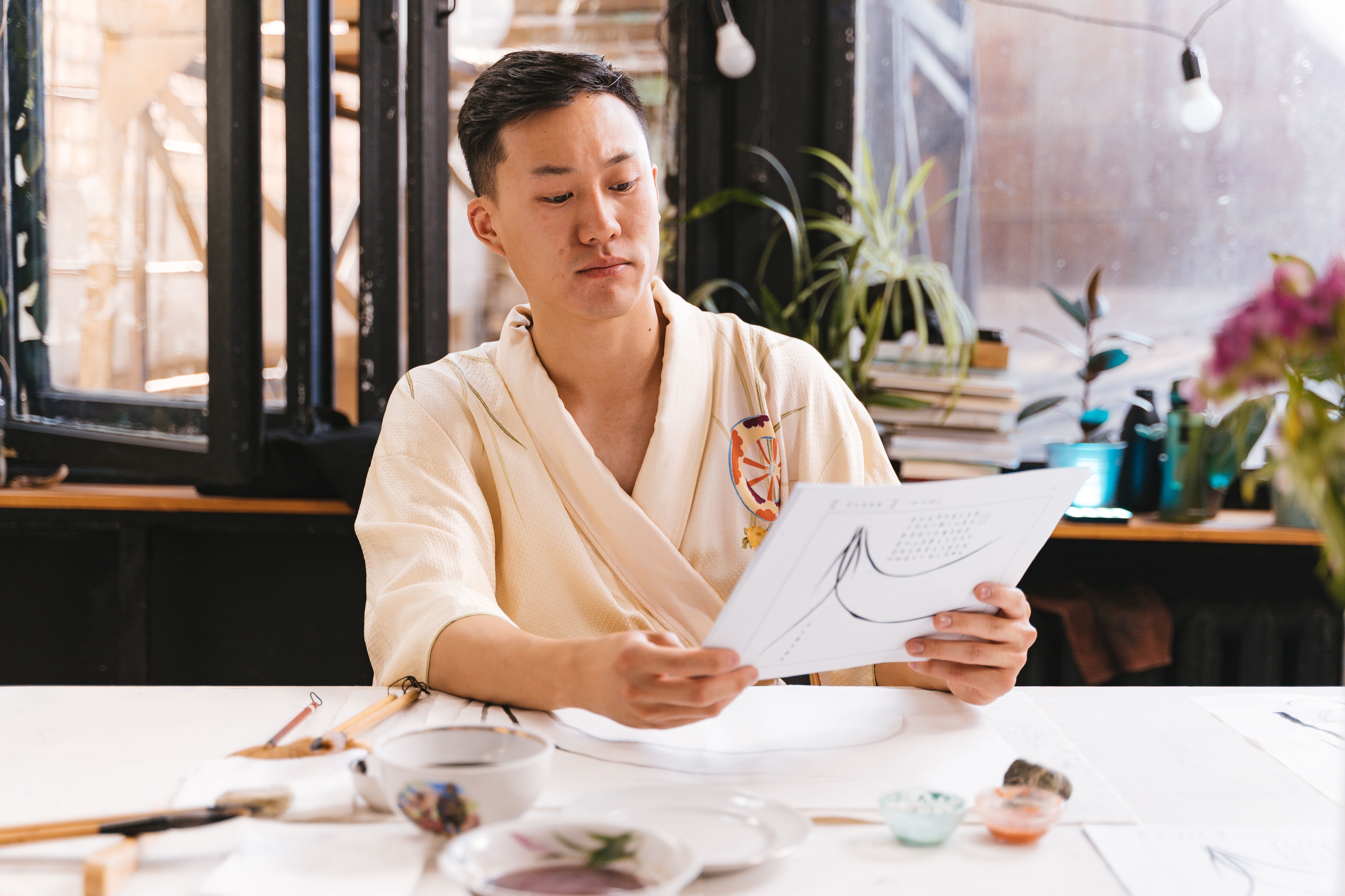 Man Looking at Drawing · Free Stock Photo