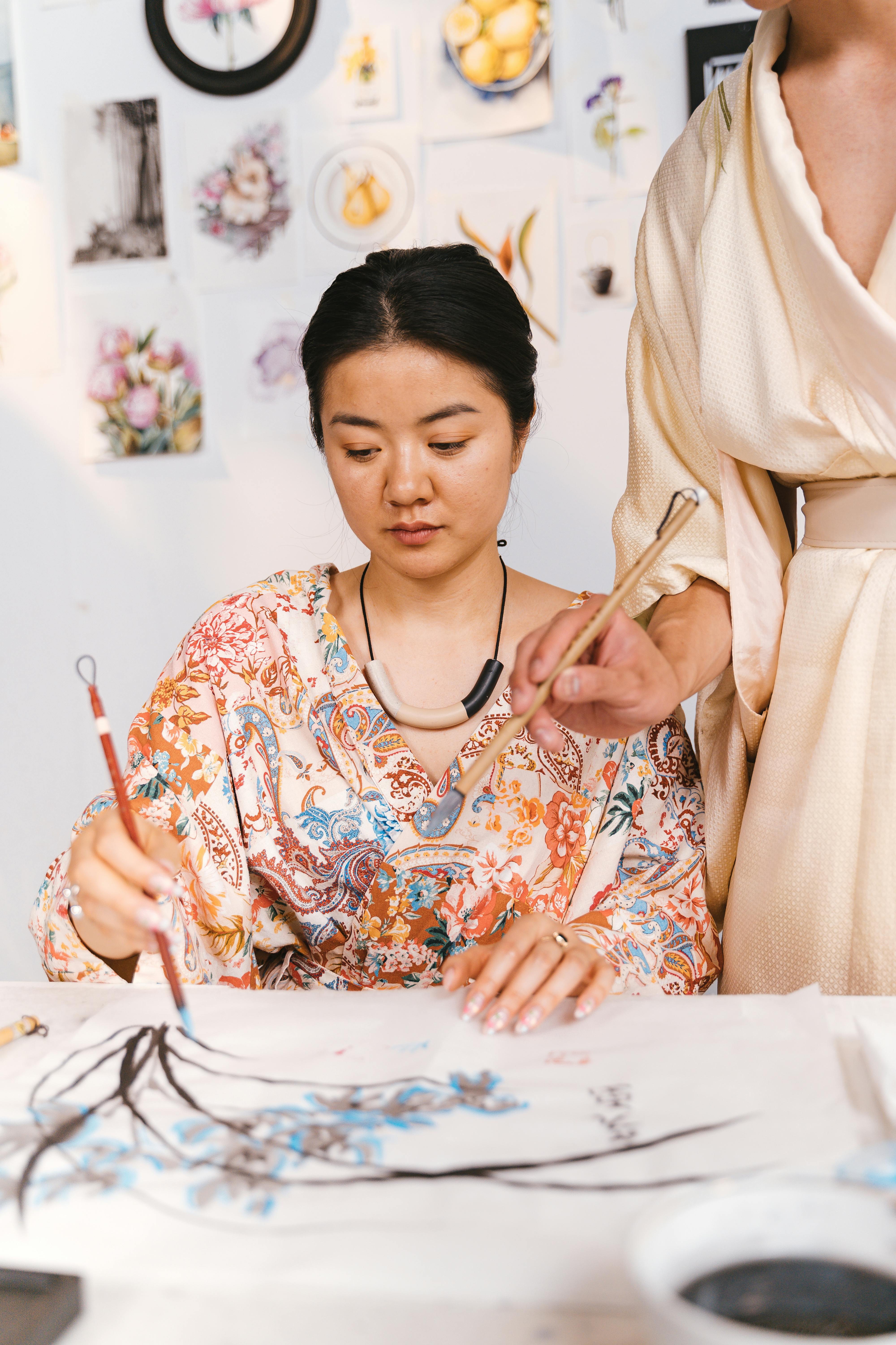 Woman and Man Hands Painting in Workshop with Traditional Asian ...