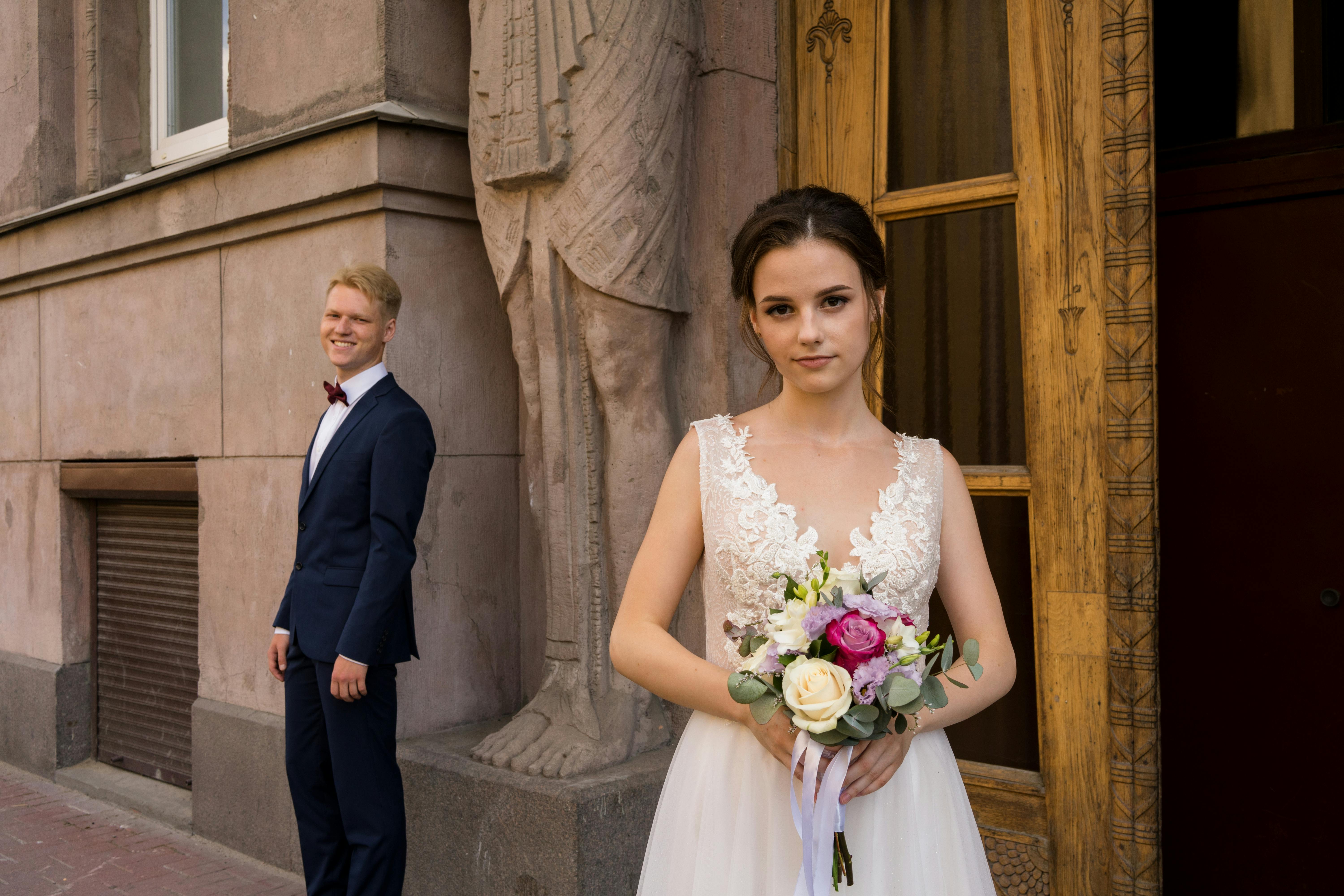 A Bride Holding a Bridal Bouquet · Free Stock Photo