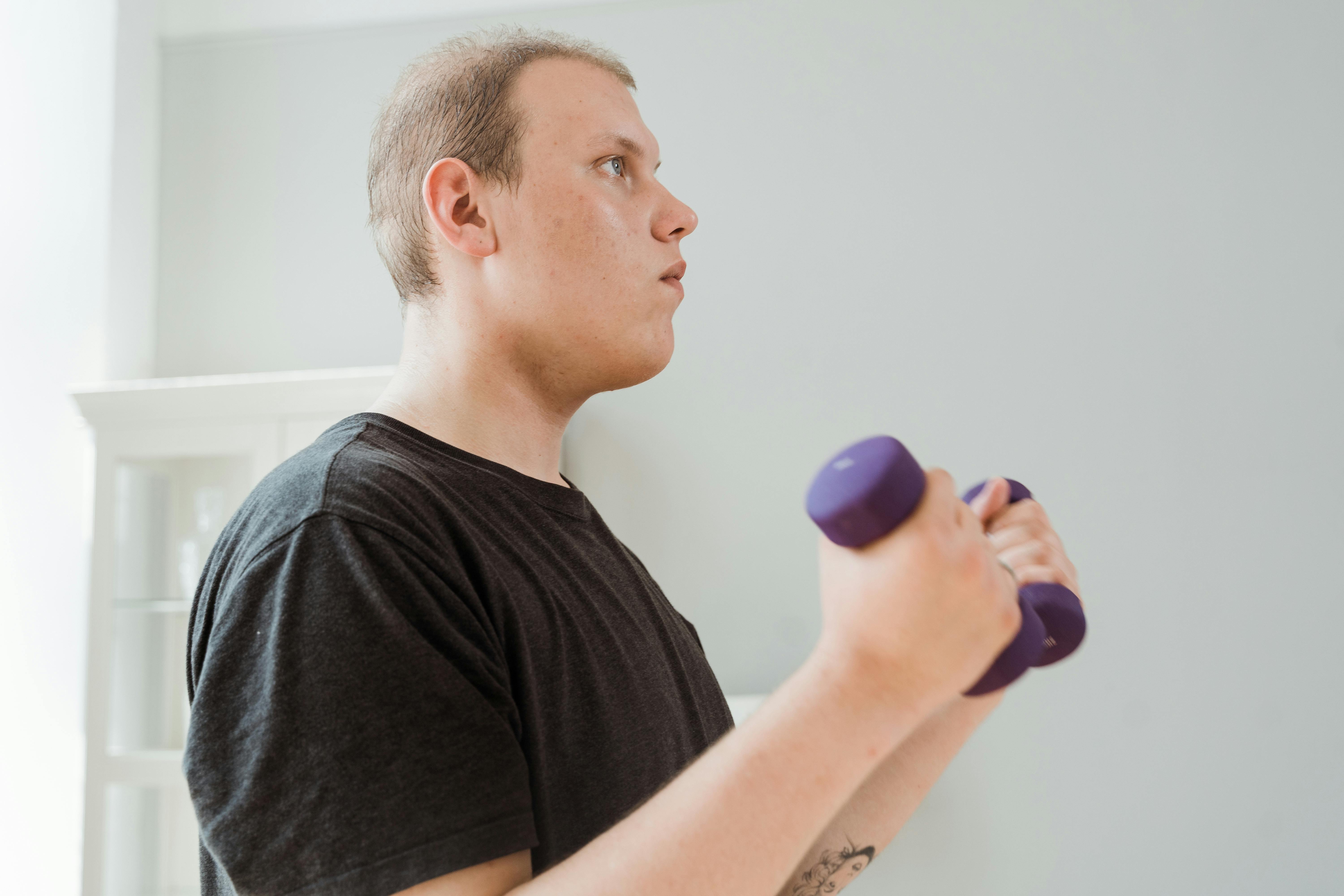 Man Exercising using Dumbbells · Free Stock Photo