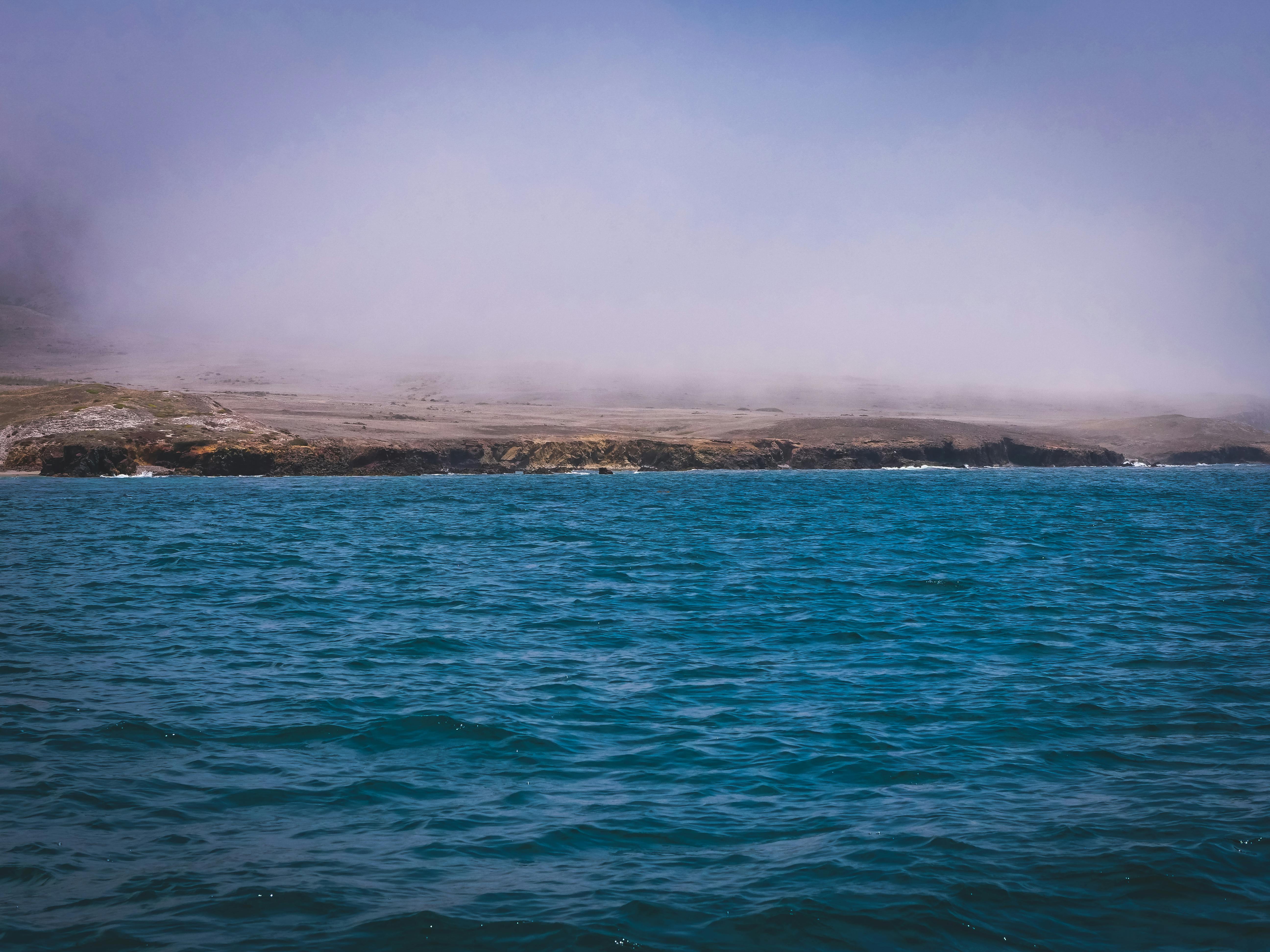 Blue Ocean Under the Thick Fog · Free Stock Photo