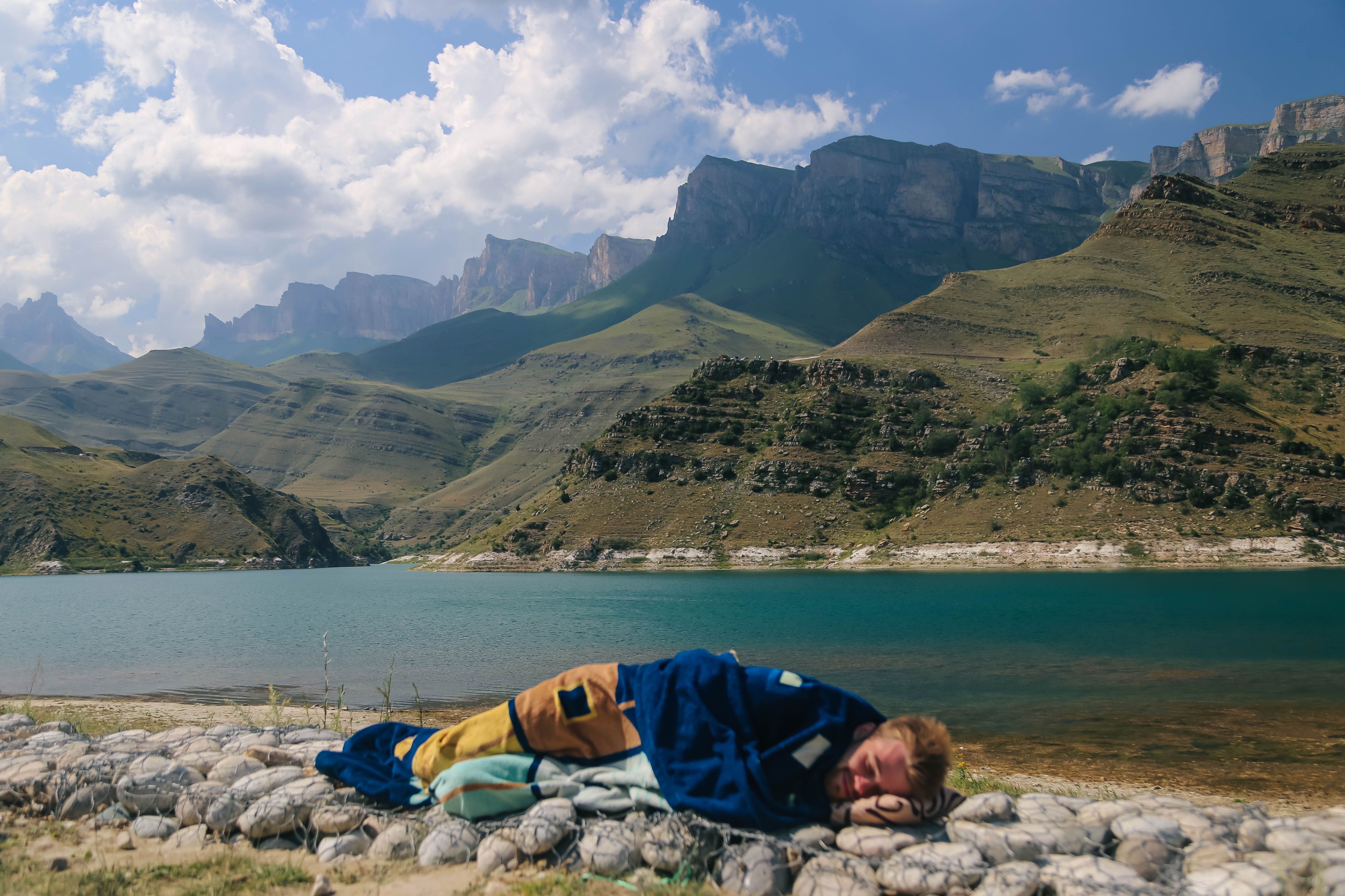 Man Sleeping by the Lake · Free Stock Photo