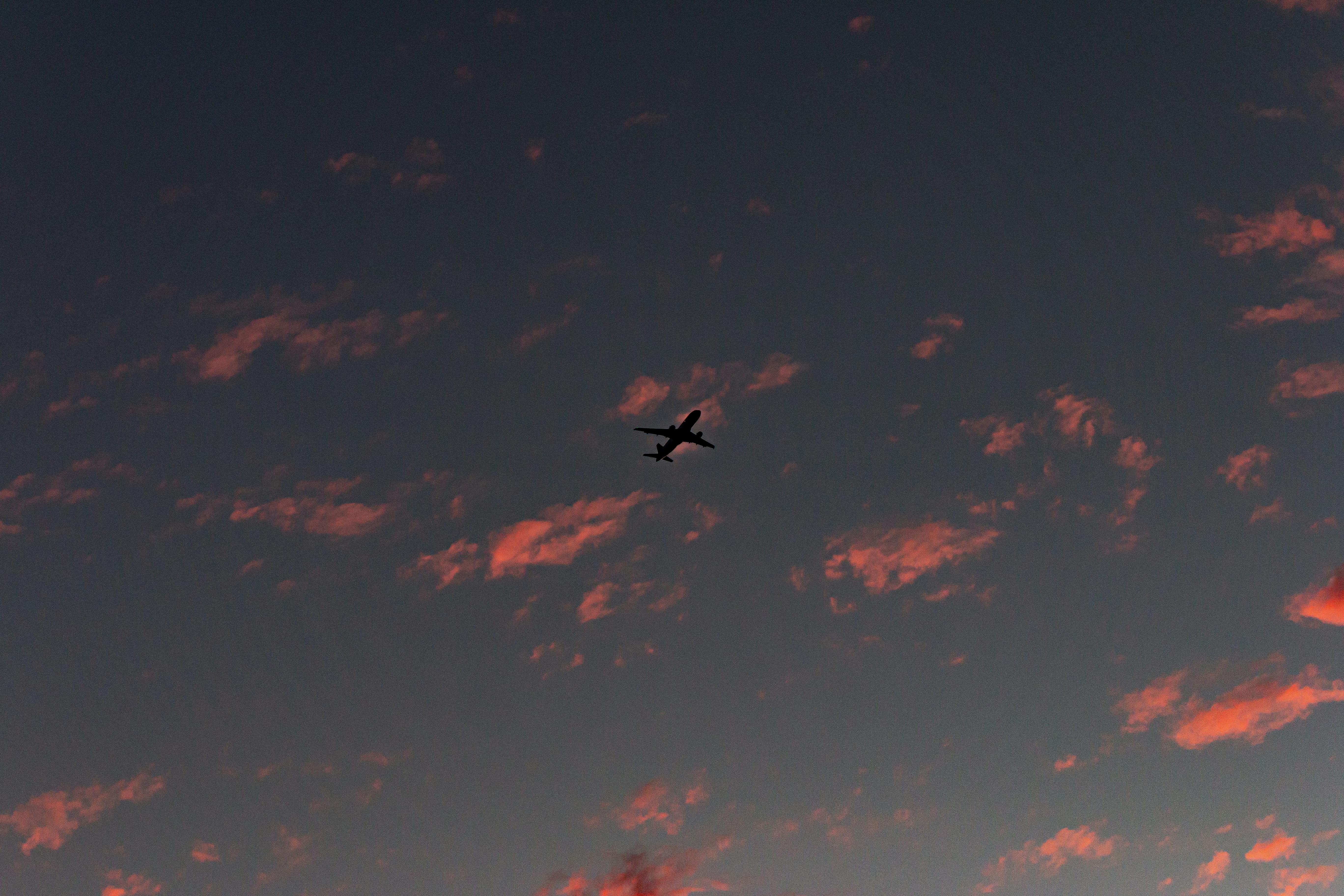 Shadow Image of a Plane Flying during Sunset · Free Stock Photo