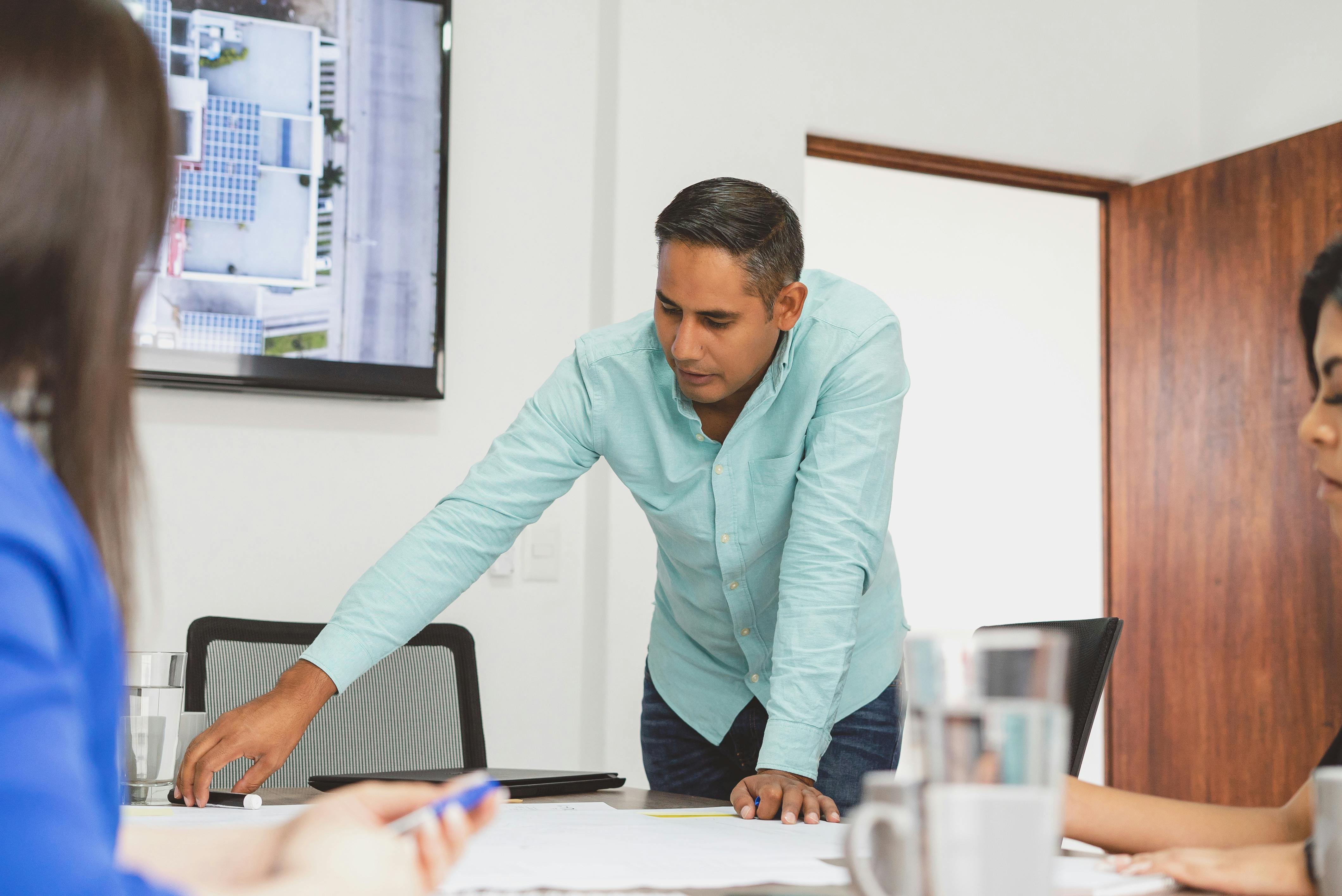 A Man Scanning a Book · Free Stock Photo