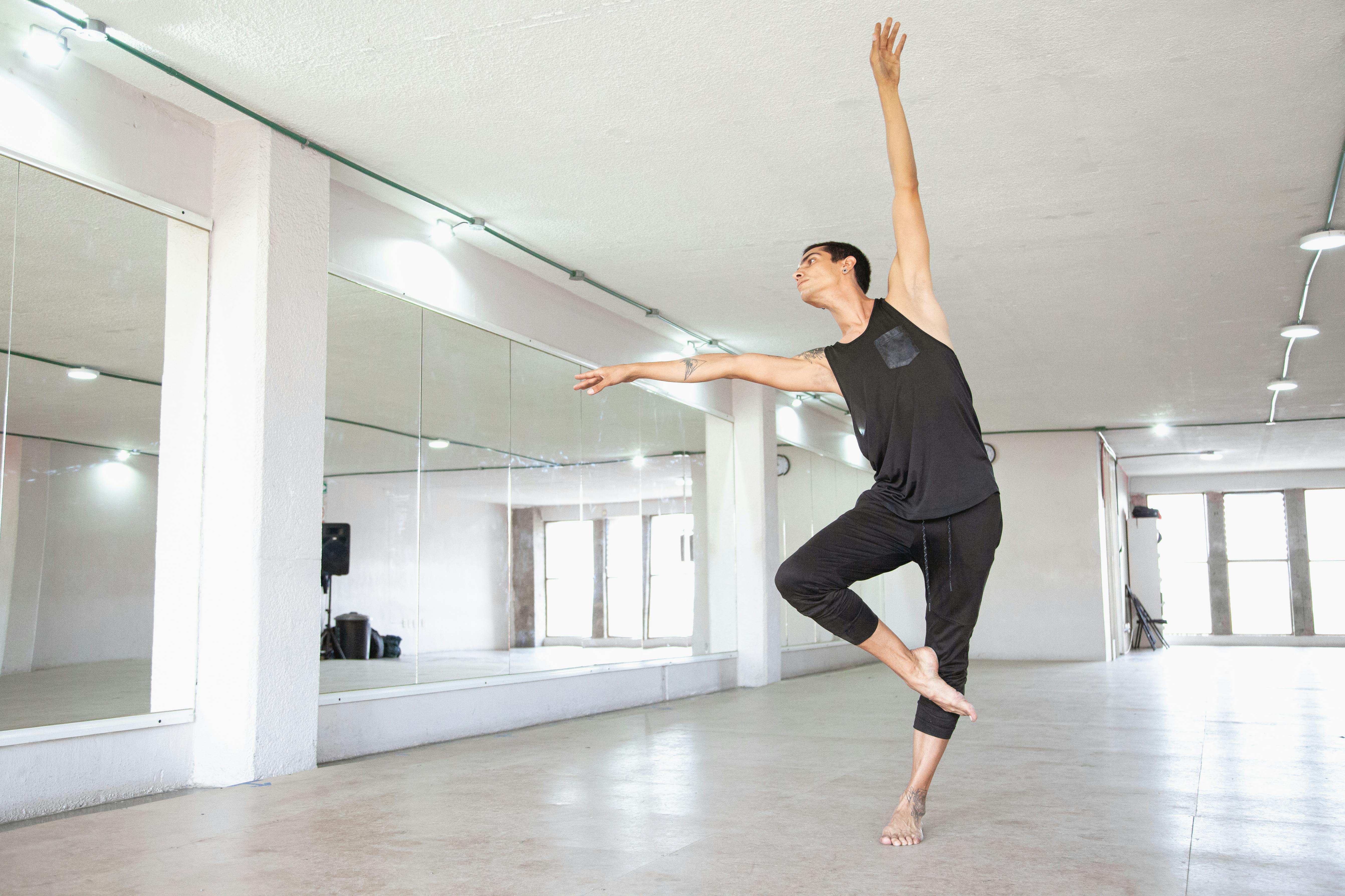 A Ballet Dancer Rehearsing Inside a Dance Studio · Free Stock Photo