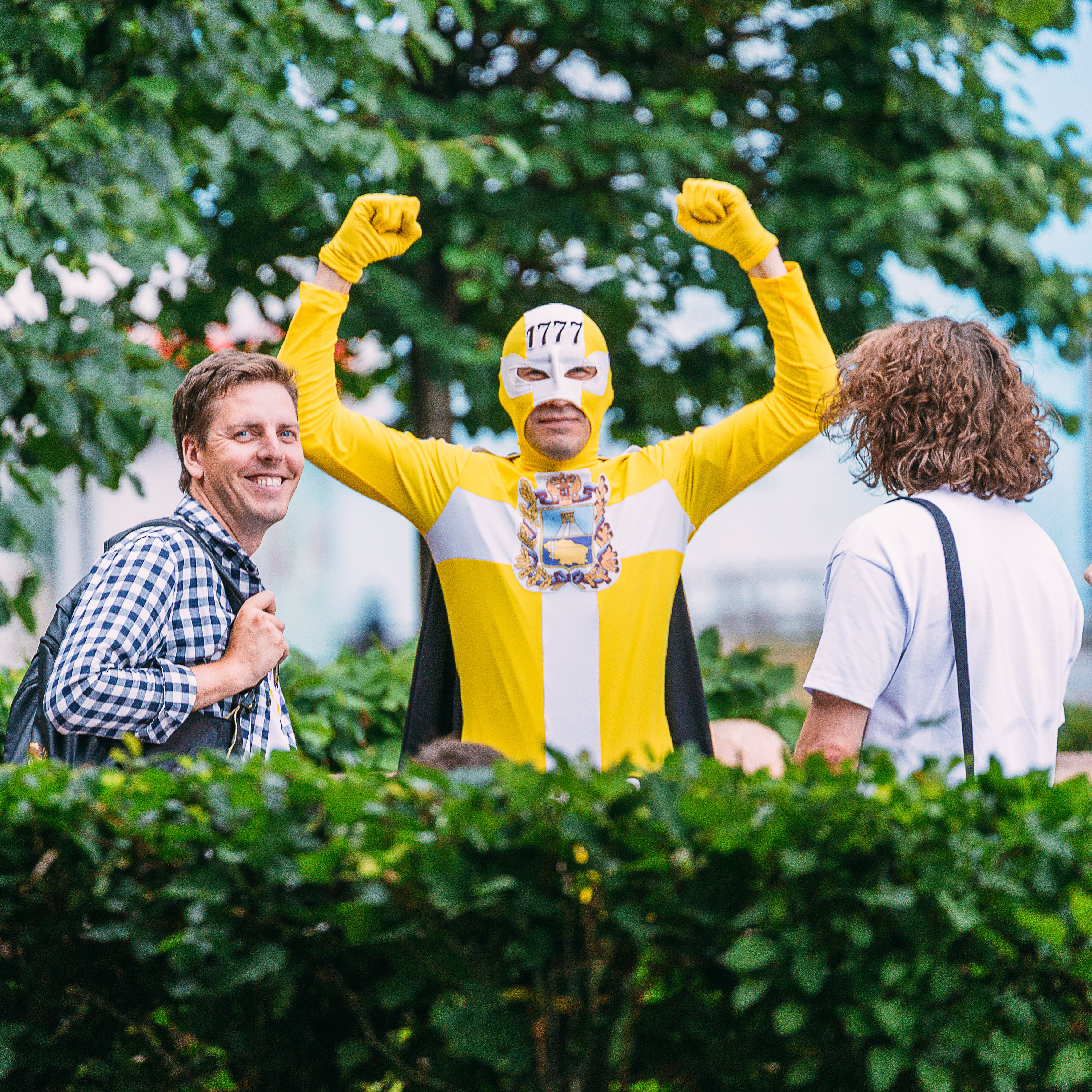 Hero in Yellow Costume with its Hands Up · Free Stock Photo