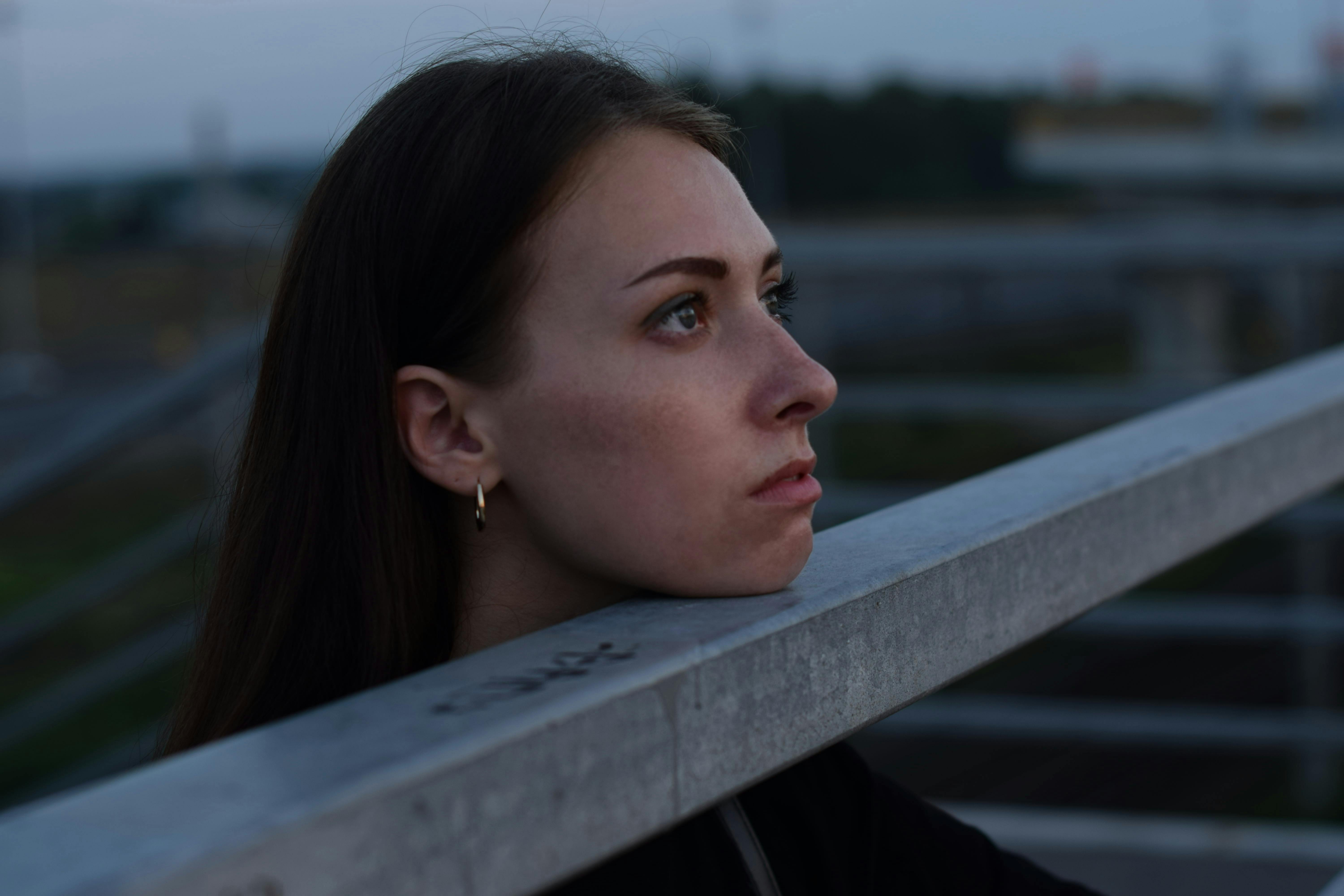 Woman Sitting on Railing · Free Stock Photo