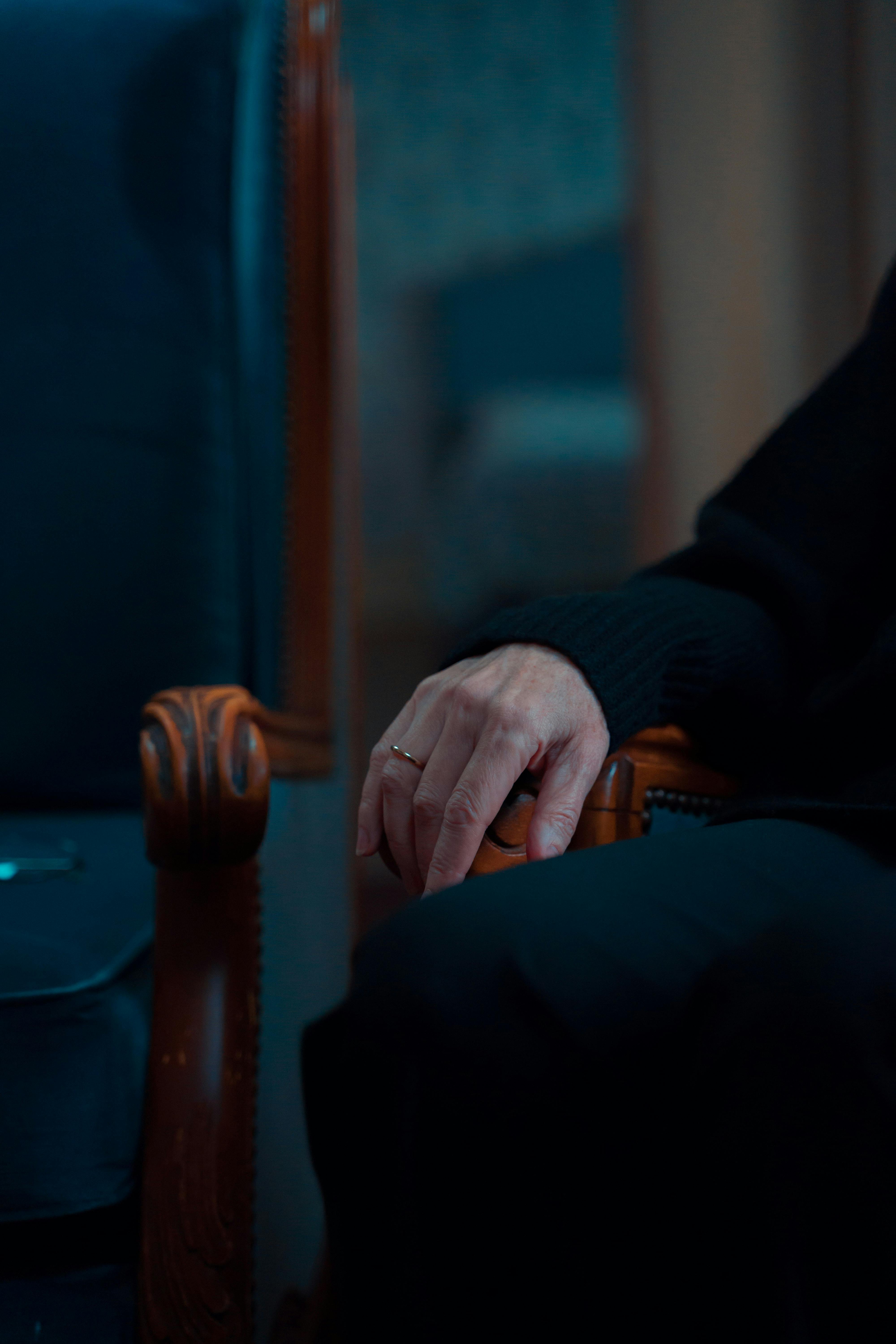 Person in Black Long Sleeves Arm Resting on Arm Rest · Free Stock Photo