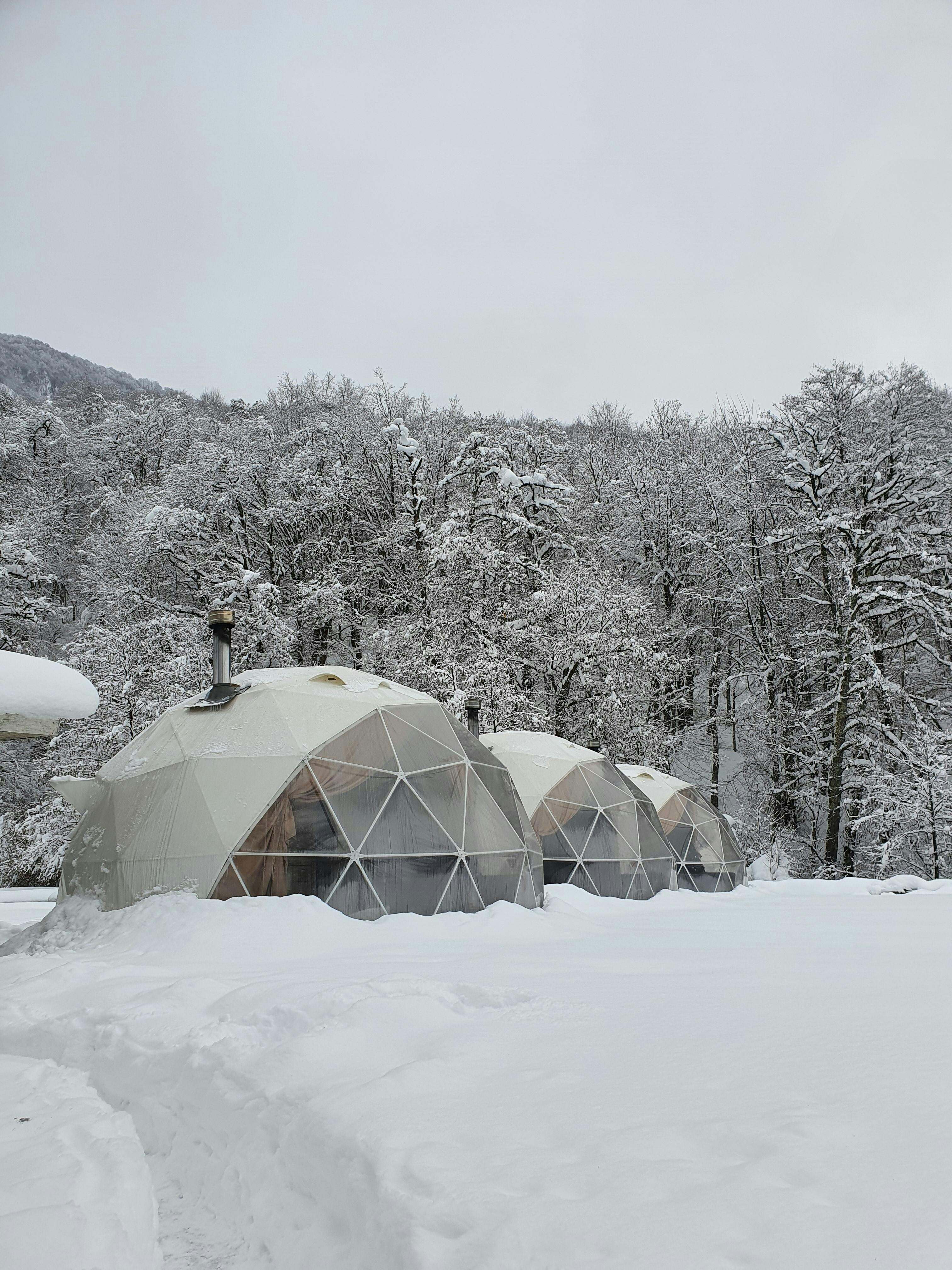 Glamping Domes on Snow Covered Ground · Free Stock Photo