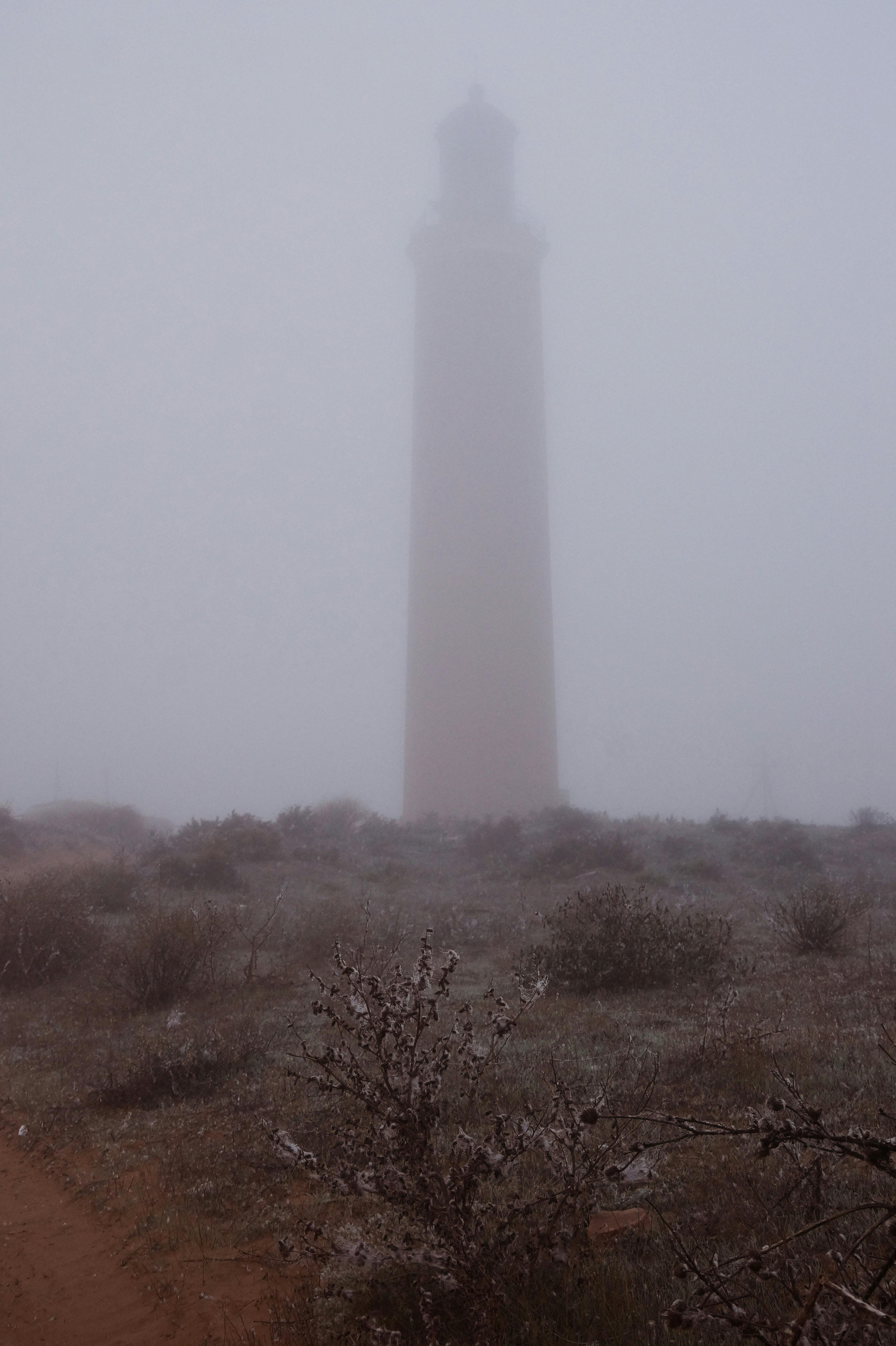 White Lighthouse On Cliff · Free Stock Photo