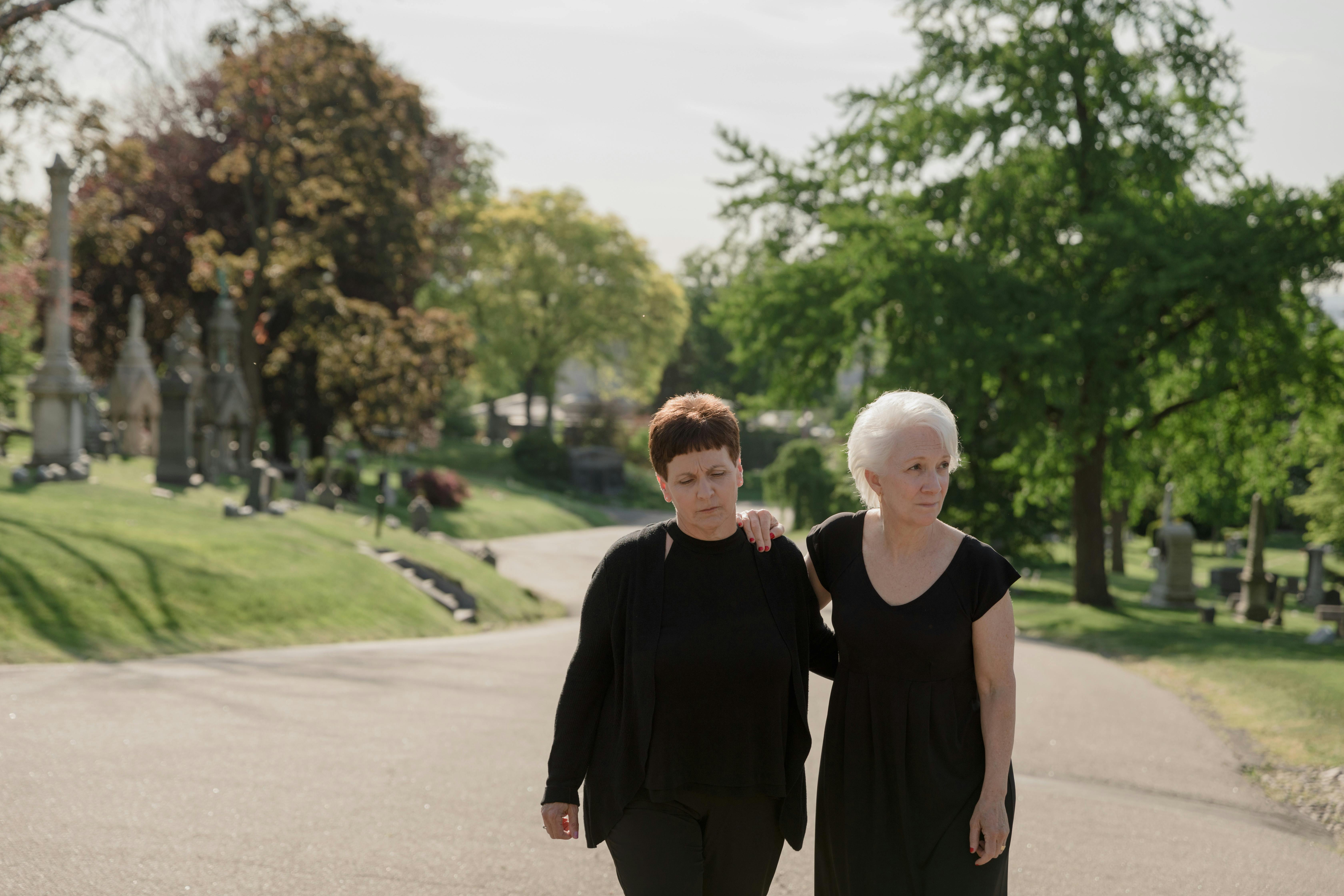 Woman Walking at a Cemetery · Free Stock Photo