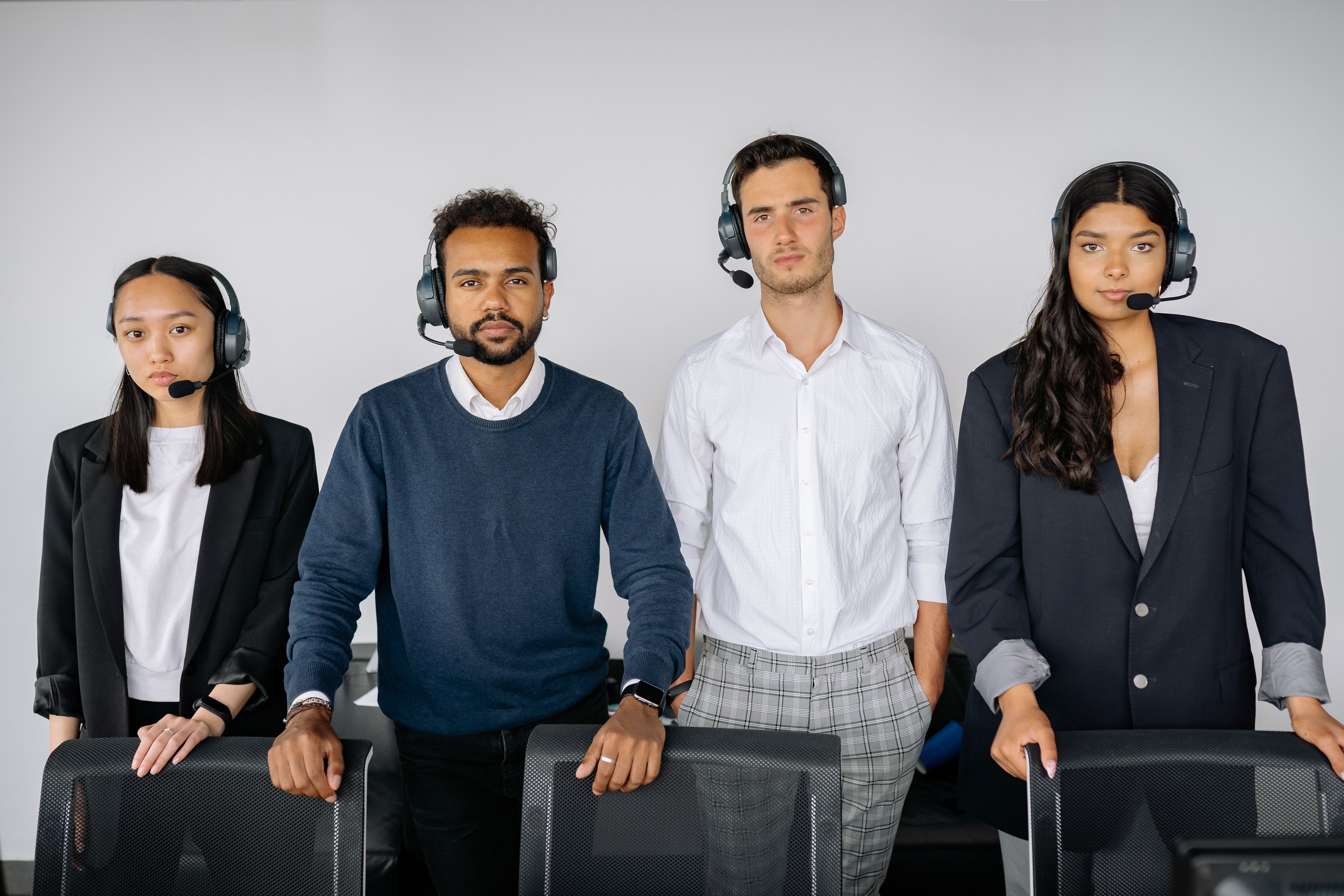 People Wearing Headset with Their Arms Crossed · Free Stock Photo
