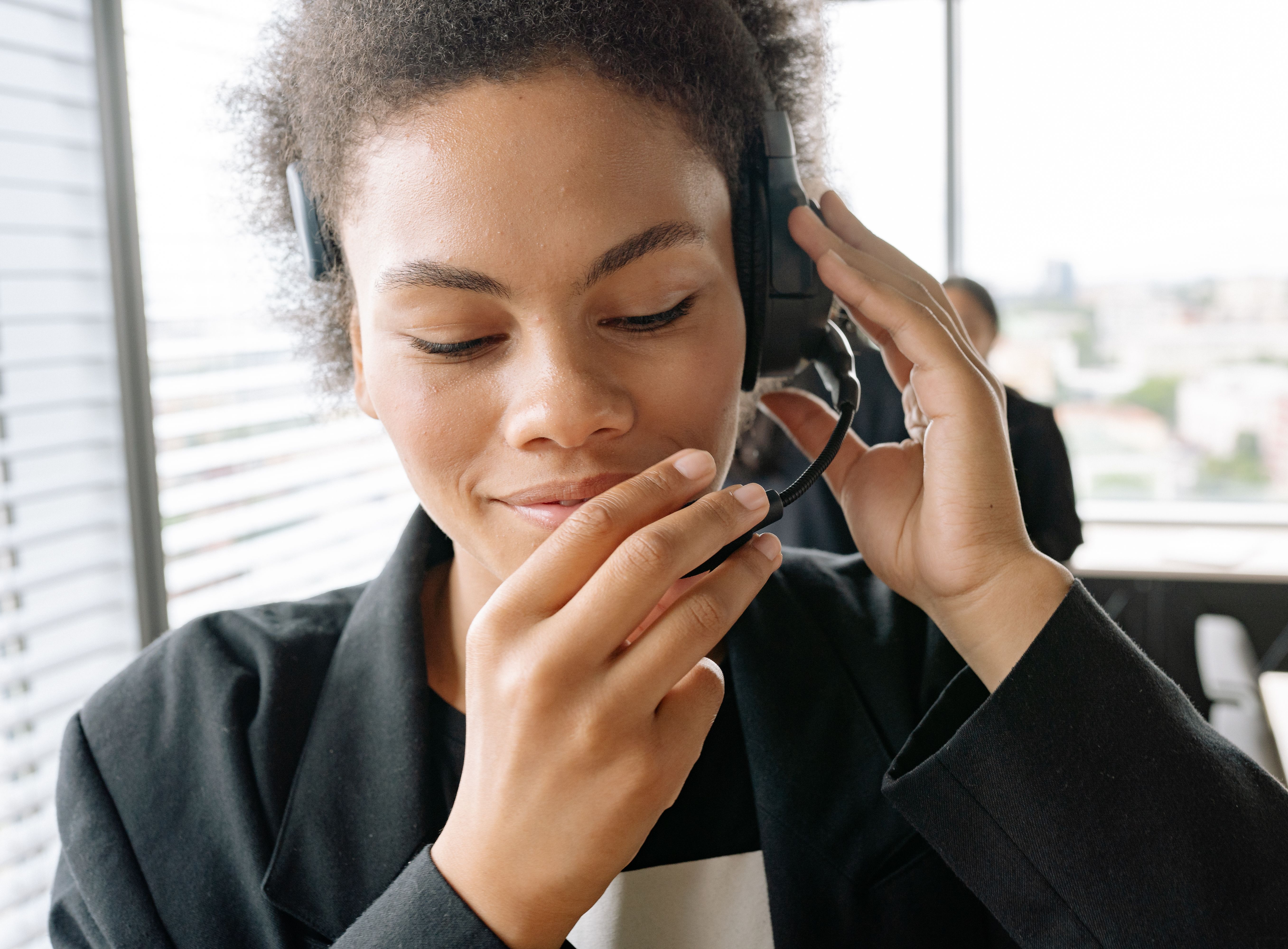 Close Up Photo of a Woman Wearing Black Headset · Free Stock Photo
