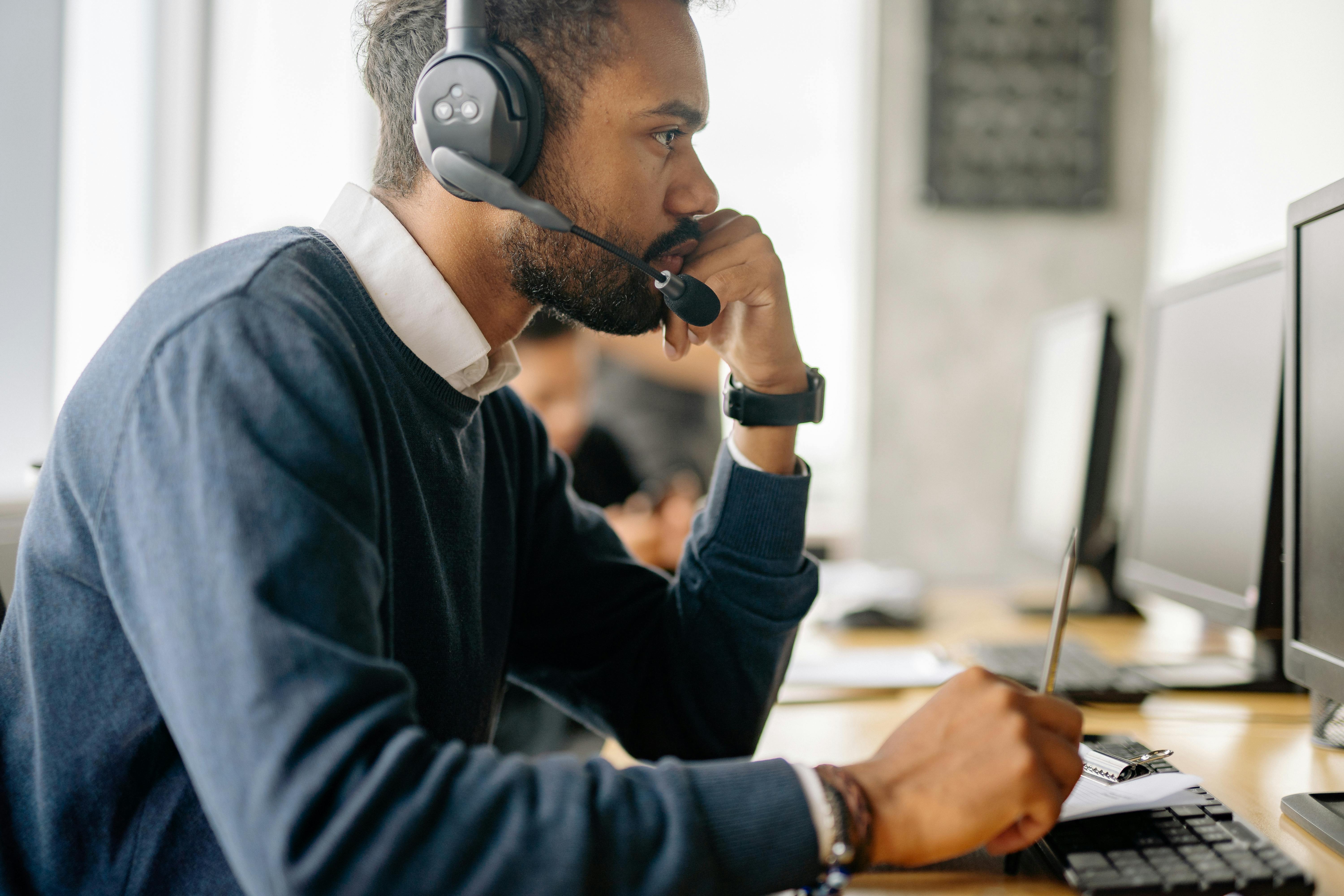 Side View of Bearded Man Looking at the Computer Monitor · Free Stock Photo