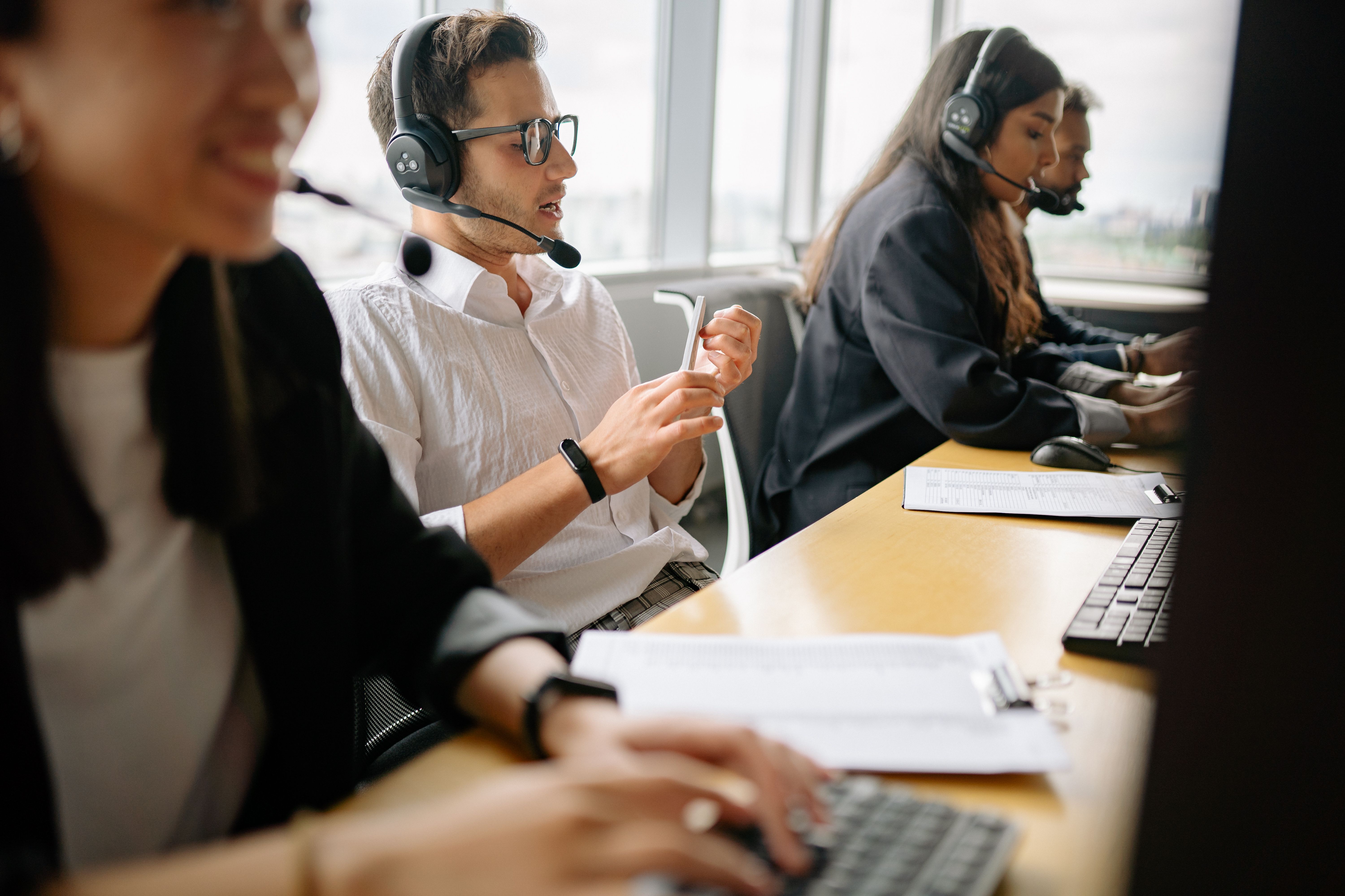 People Wearing Headsets Working in an Office · Free Stock Photo