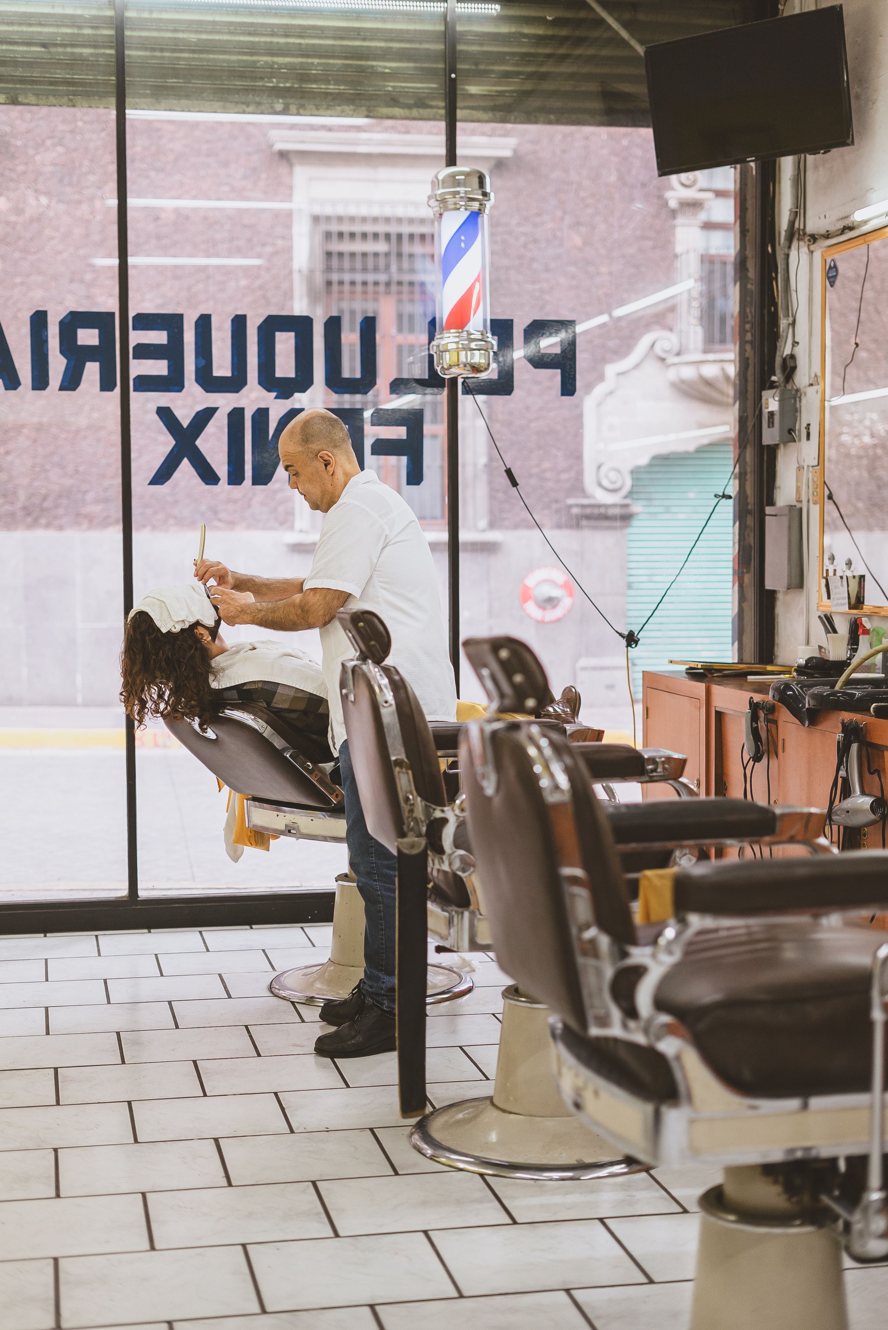 Barber Shaving his Client · Free Stock Photo