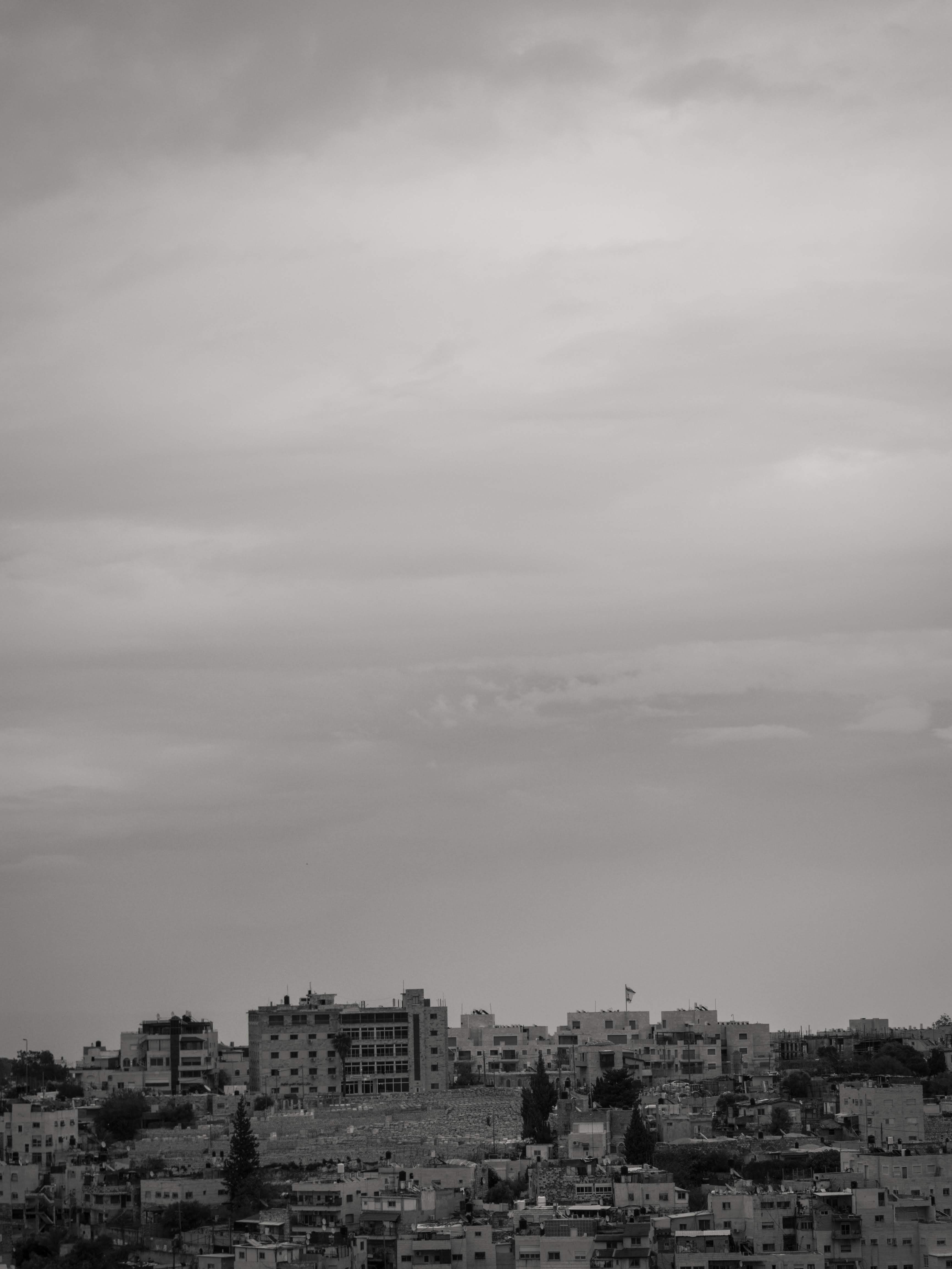 Gray Building Under Clouds · Free Stock Photo
