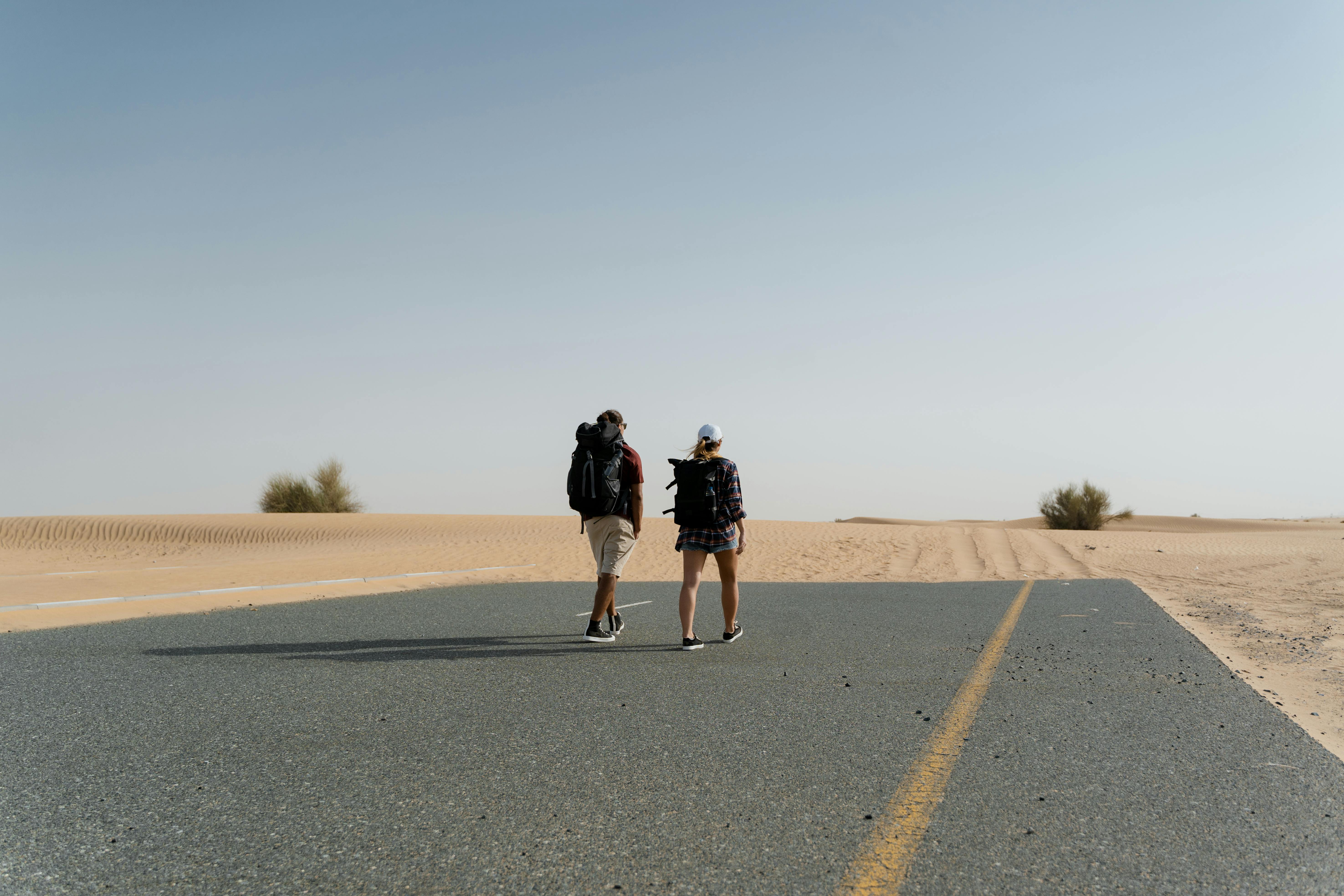 People Walking on Asphalt Road · Free Stock Photo