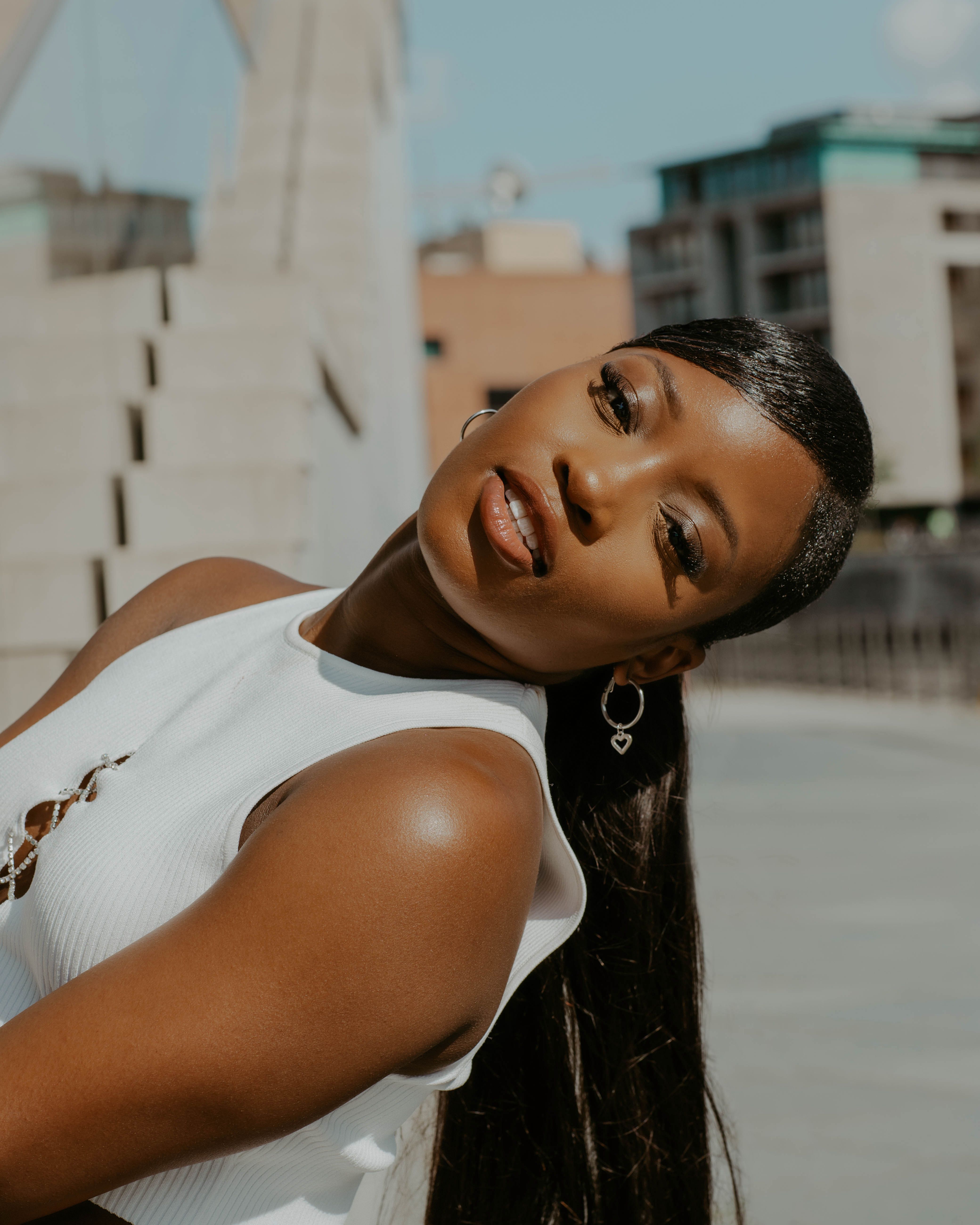 Woman in White Top Posing · Free Stock Photo