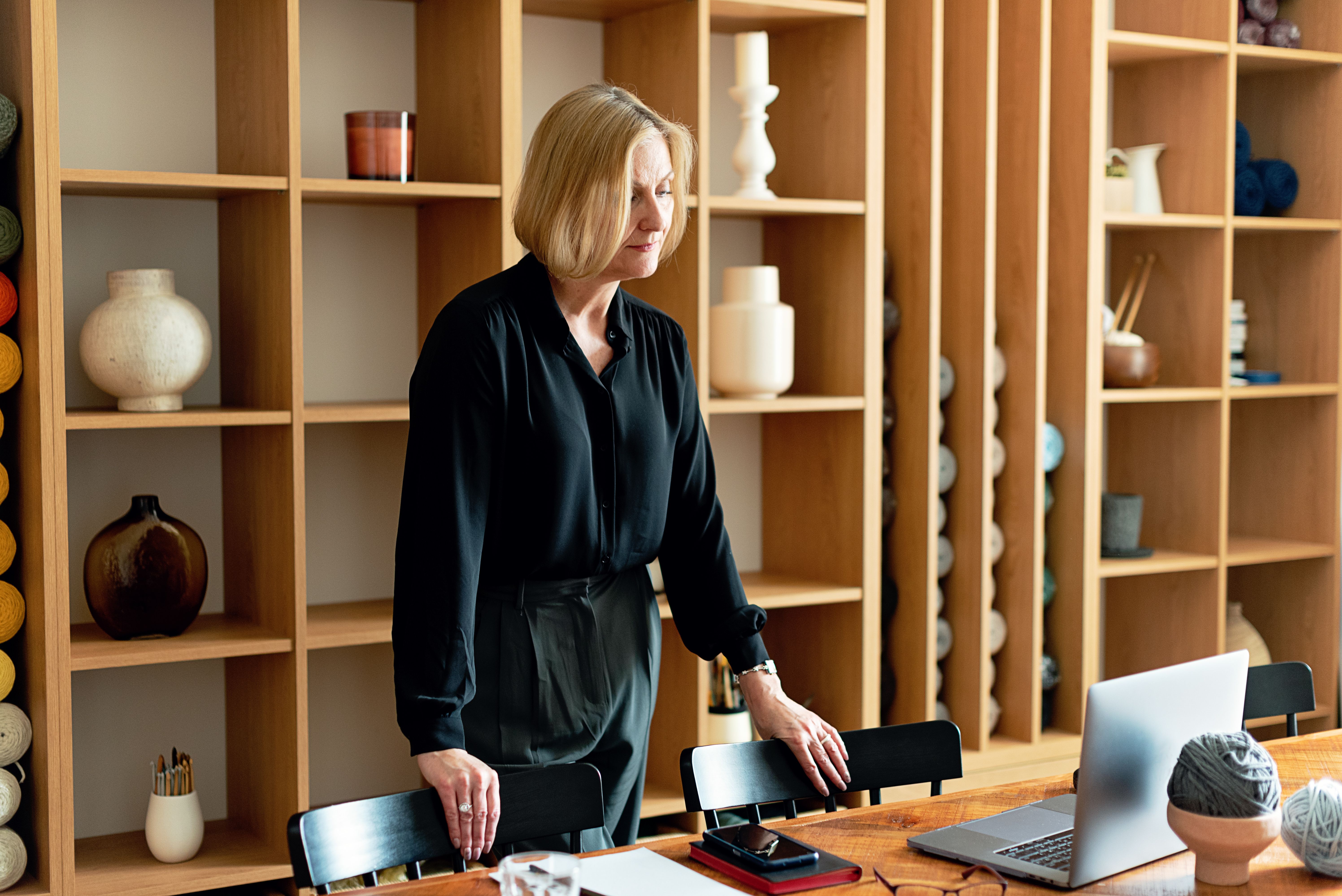 Woman Standing in Front of a Laptop · Free Stock Photo