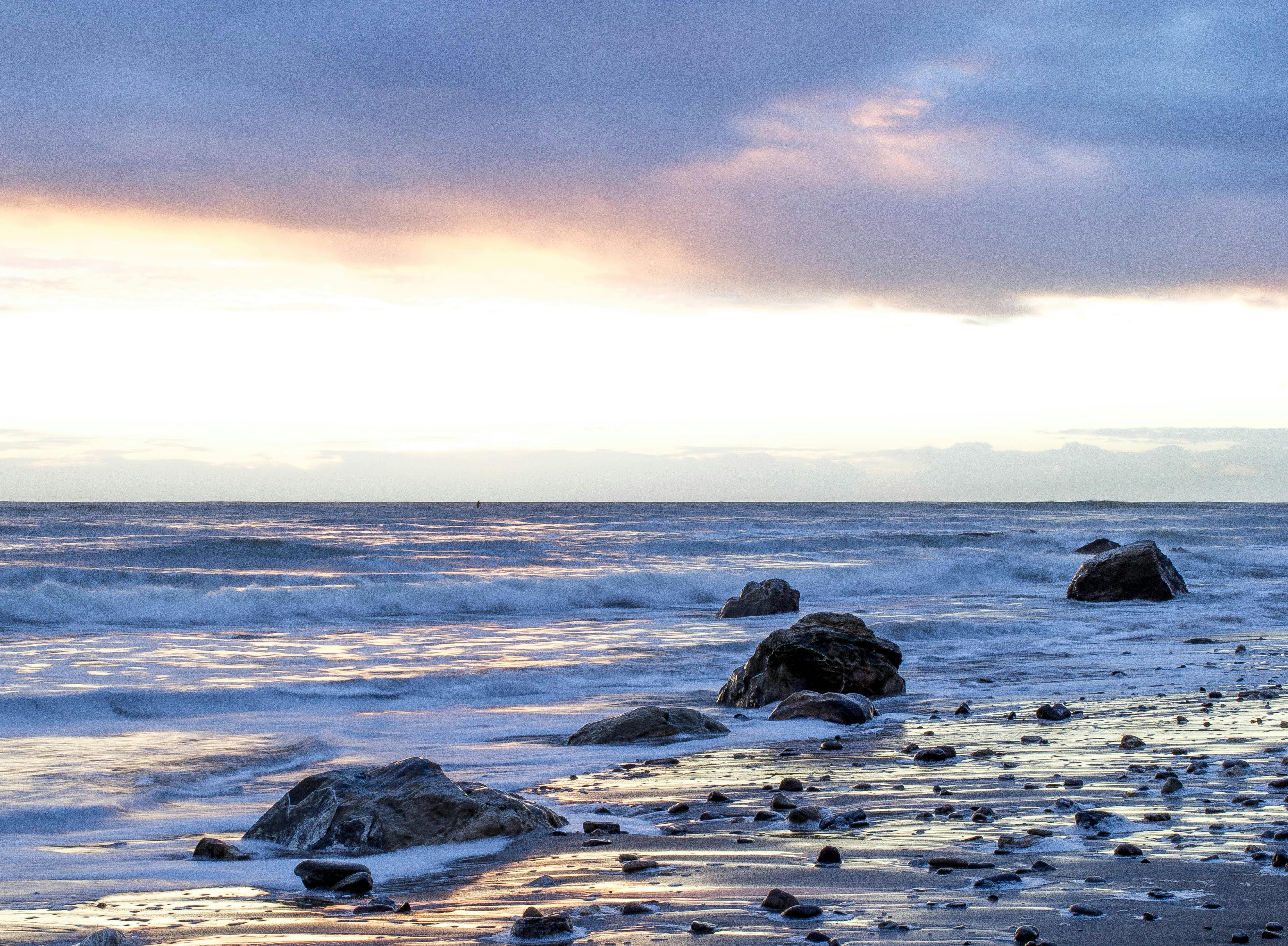 Sea Waves Splashing Through Rocks · Free Stock Photo