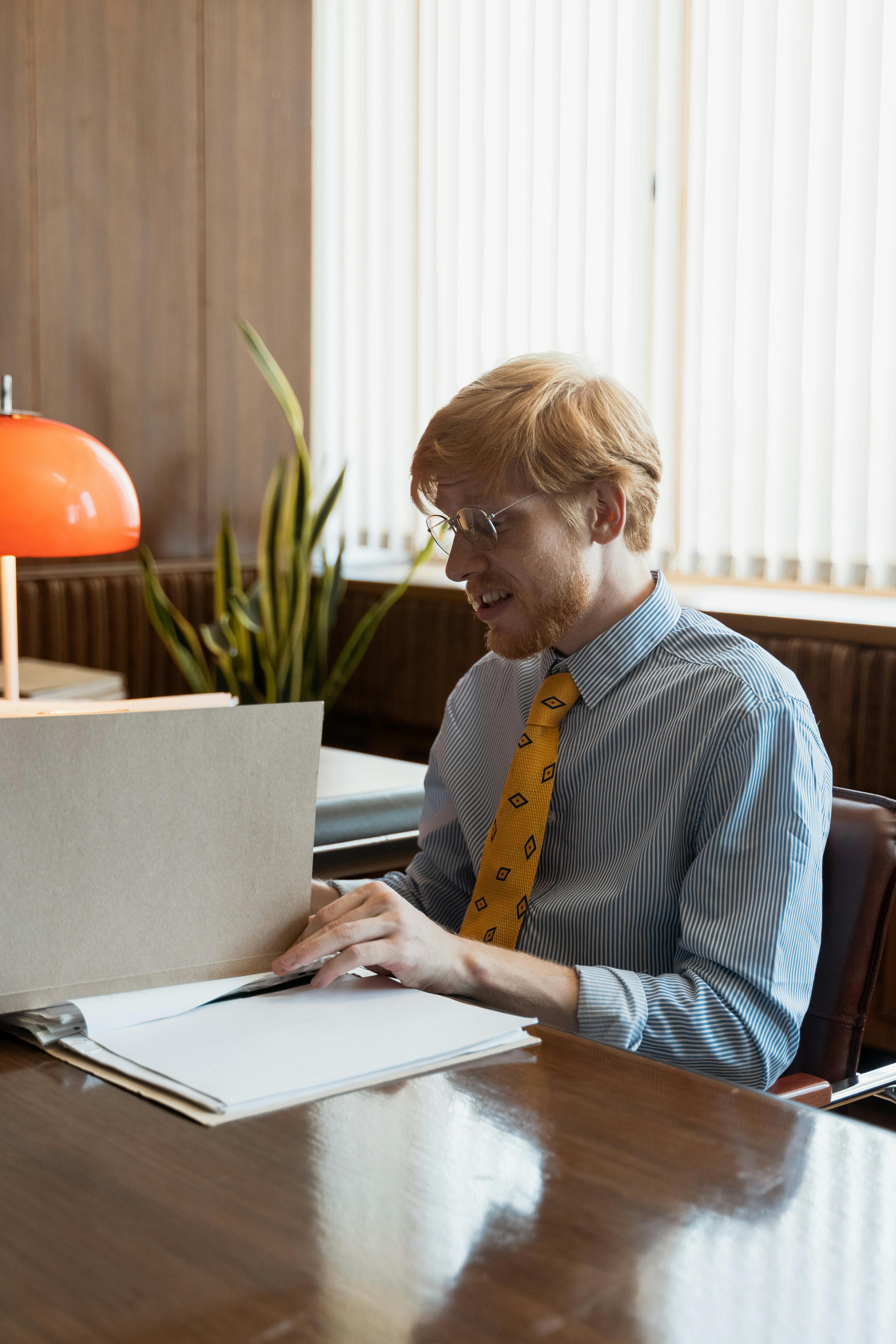 A Man Looking at Documents · Free Stock Photo