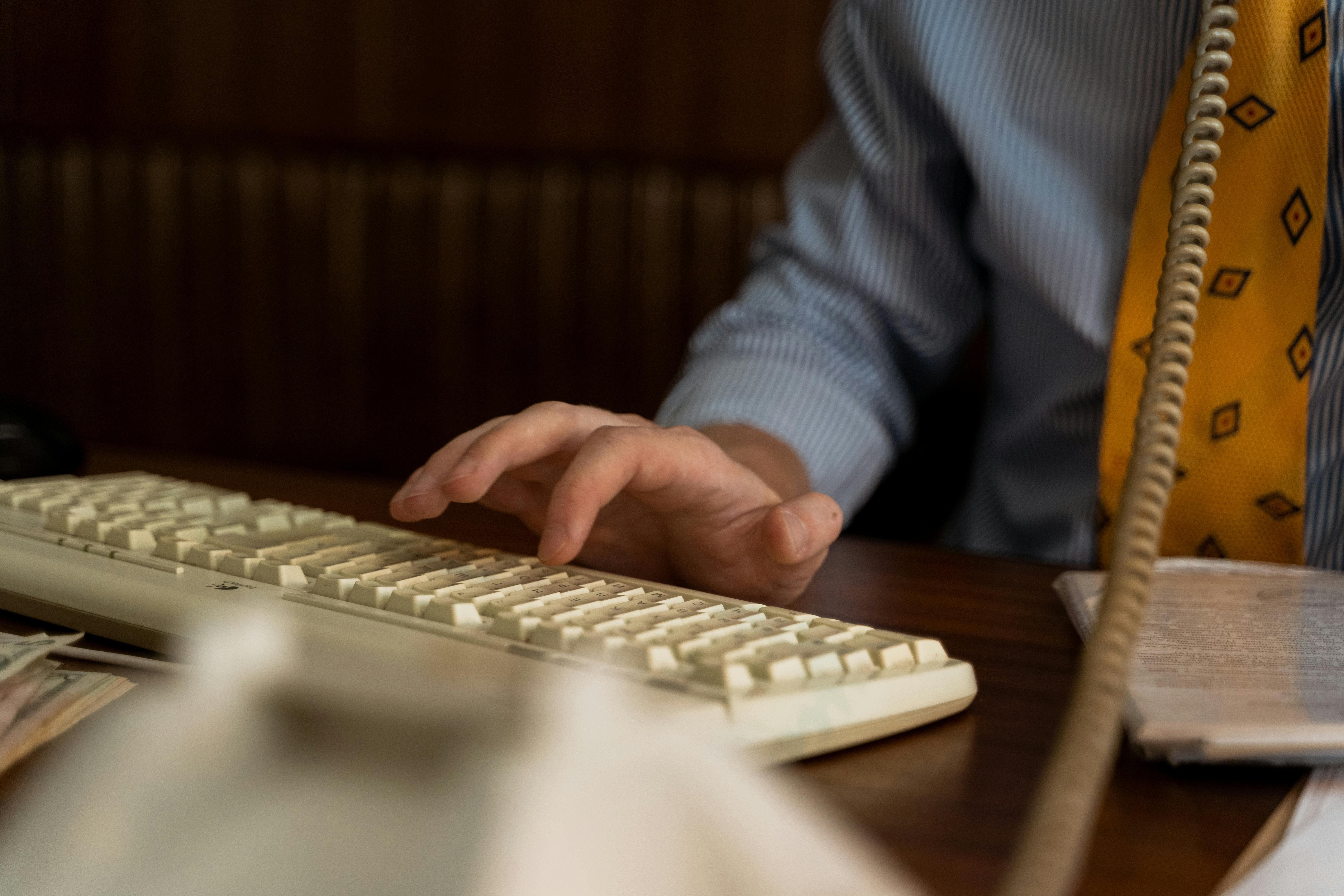 A Person Typing on the Keyboard · Free Stock Photo