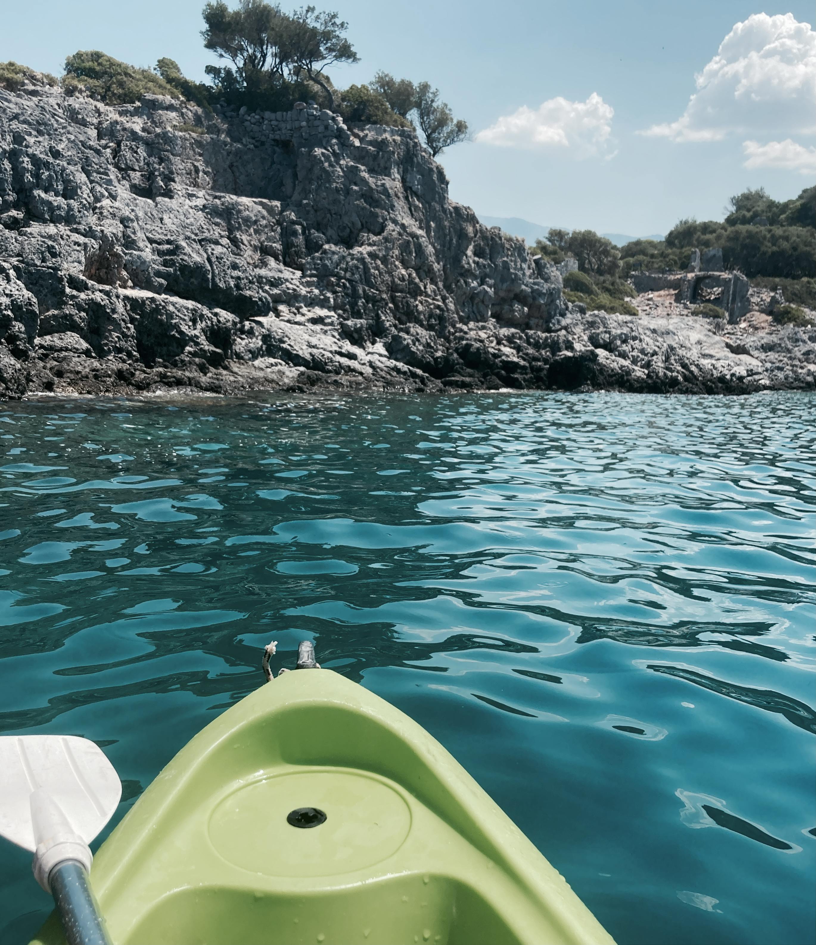 Boat on Sea near Cliff · Free Stock Photo