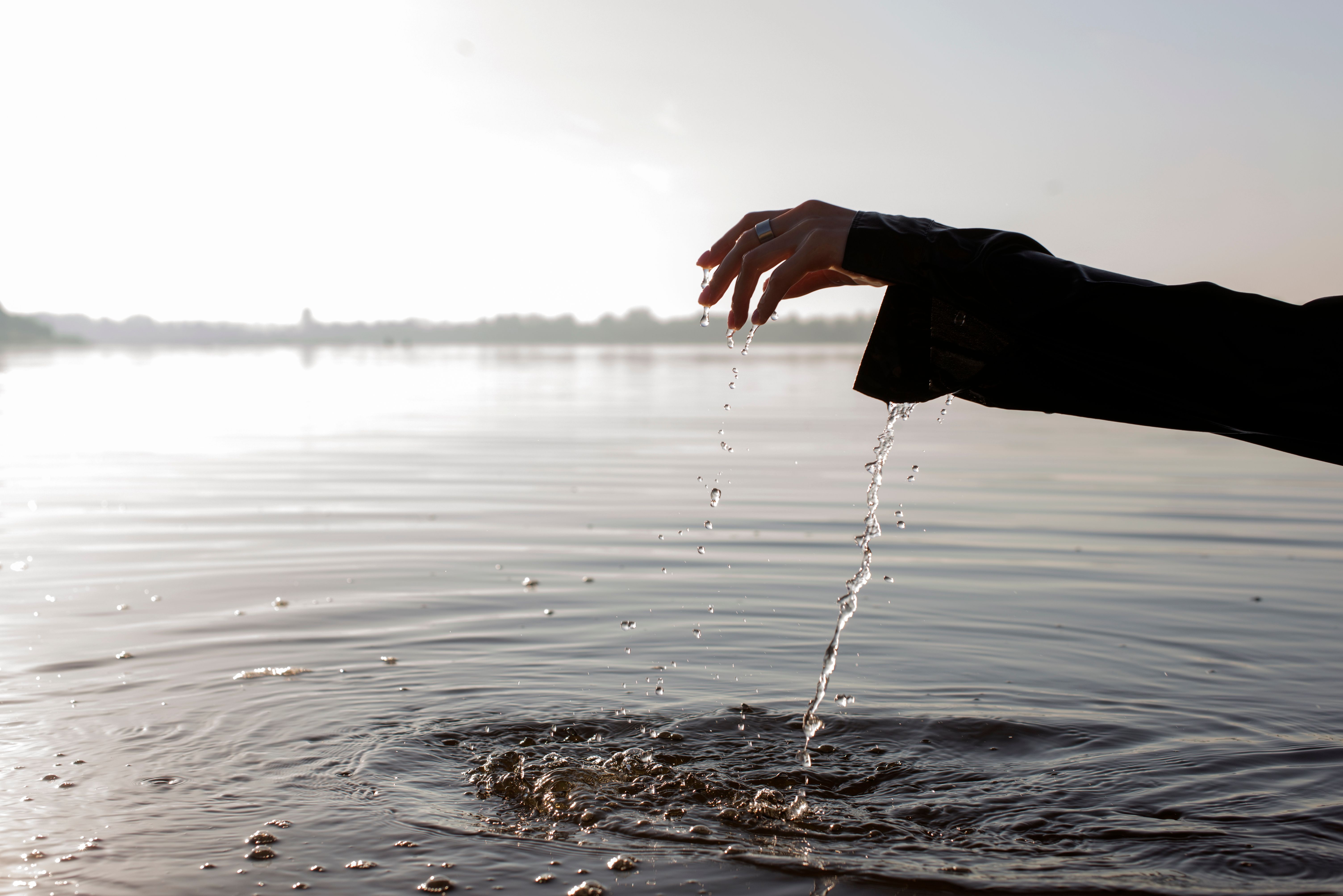 Water Dripping From a Person's Hand · Free Stock Photo